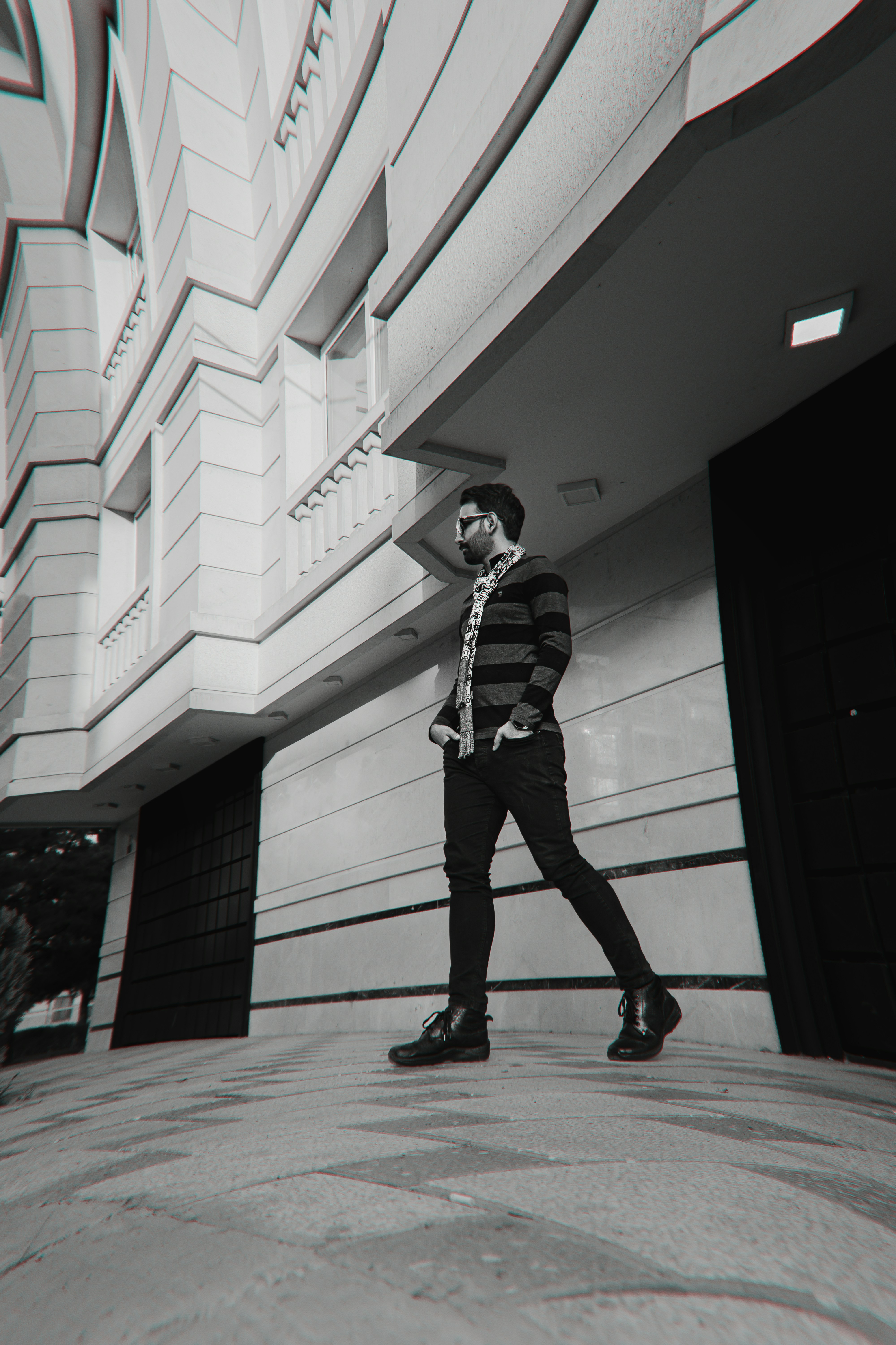 Monochrome stride beneath a symphony of angles