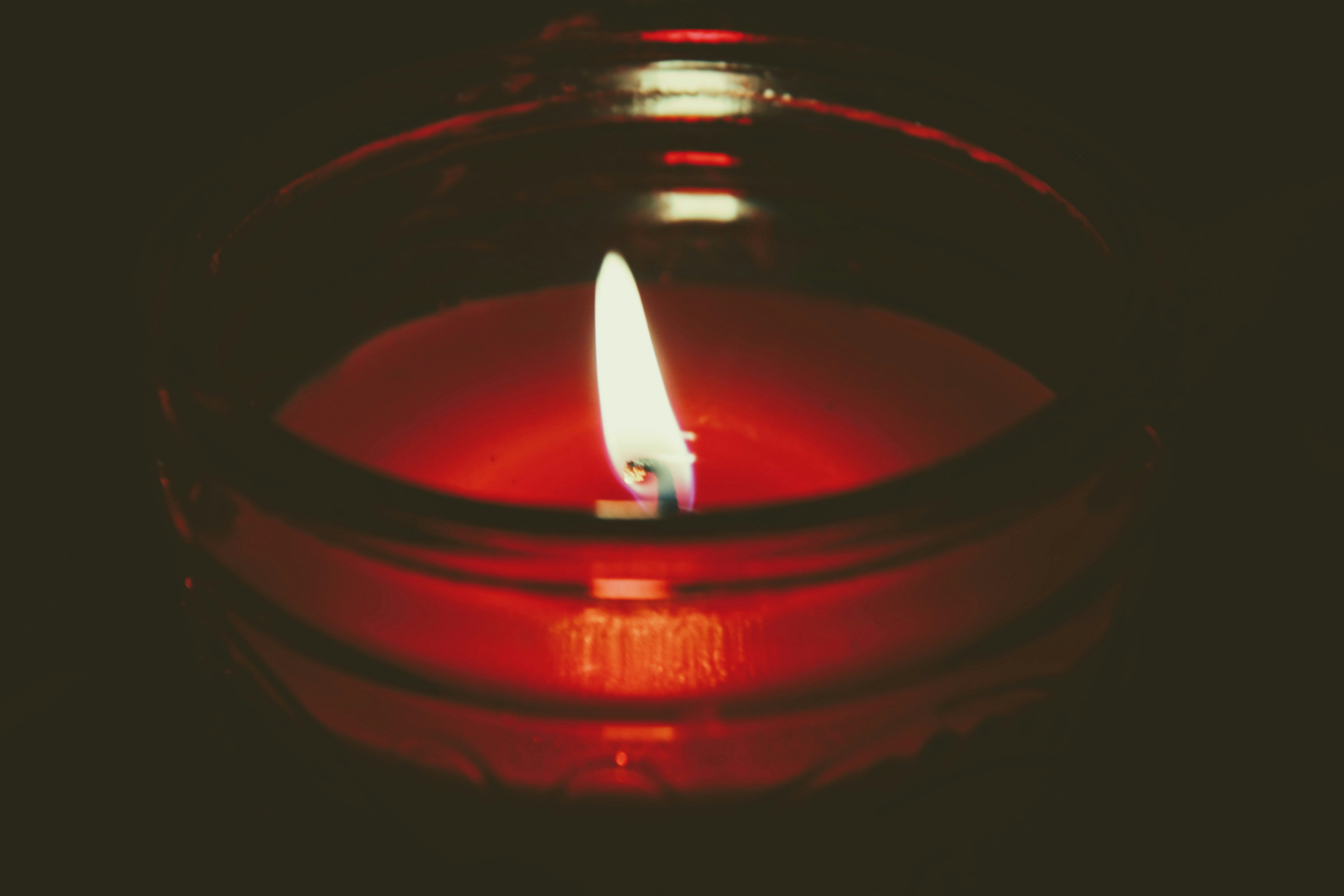 Crimson Whisper: Candlelight in a Glass Votive