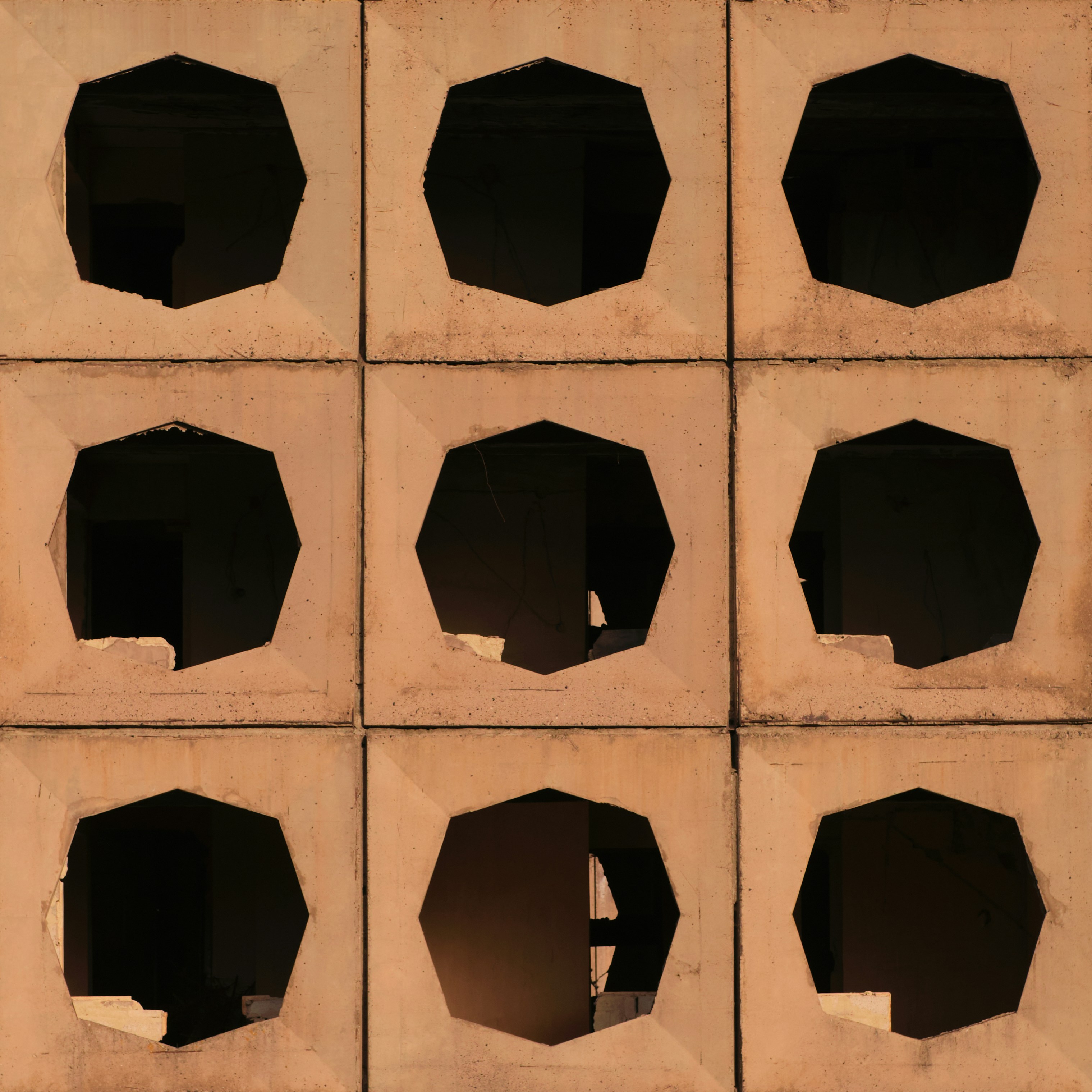 A bunch of holes in the side of a building photo – Free Soviet ...