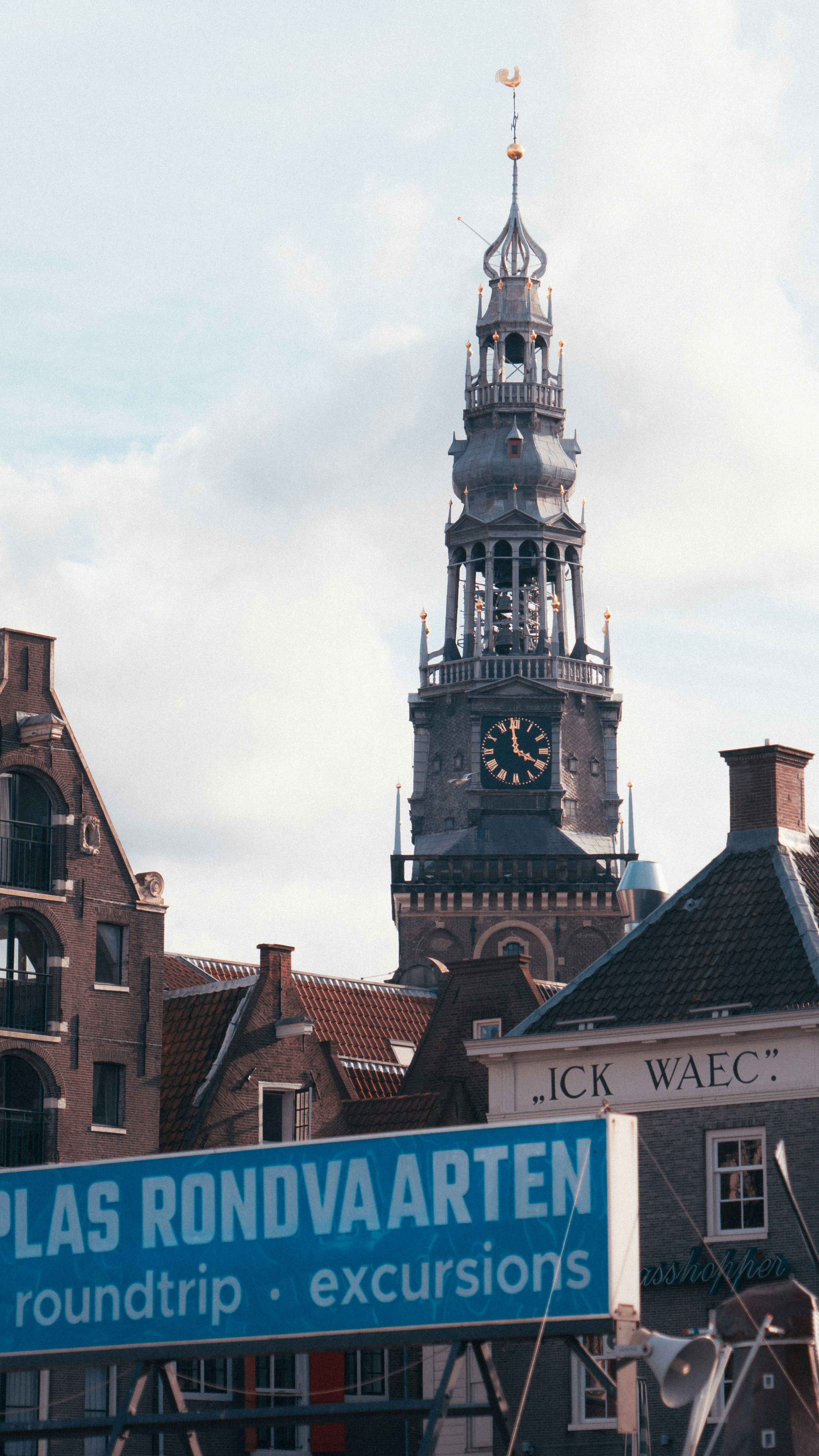 A tall clock tower towering over a city photo – Free Clock tower Image ...