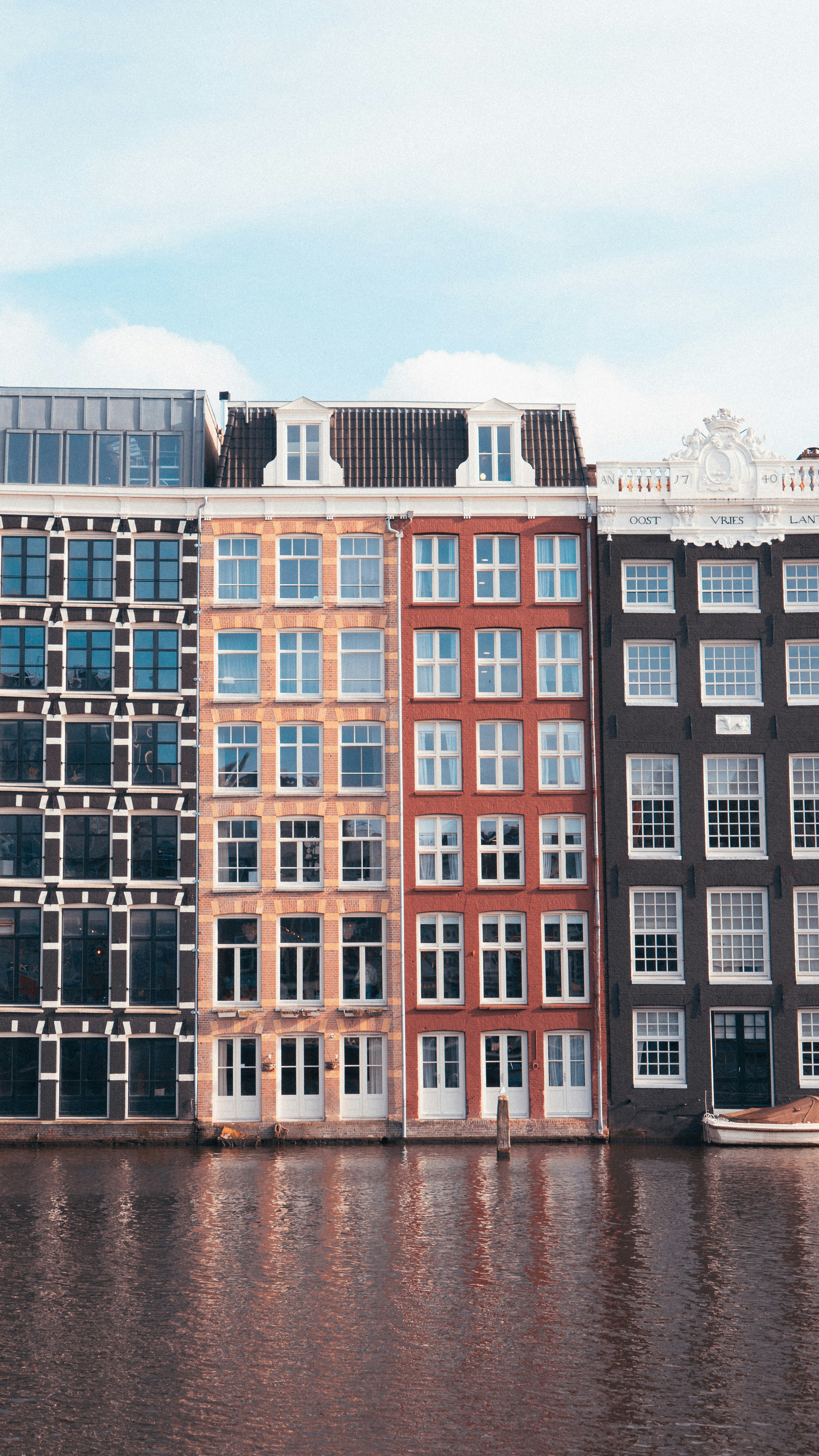 Row of Delft-like Houses Reflected in Canal