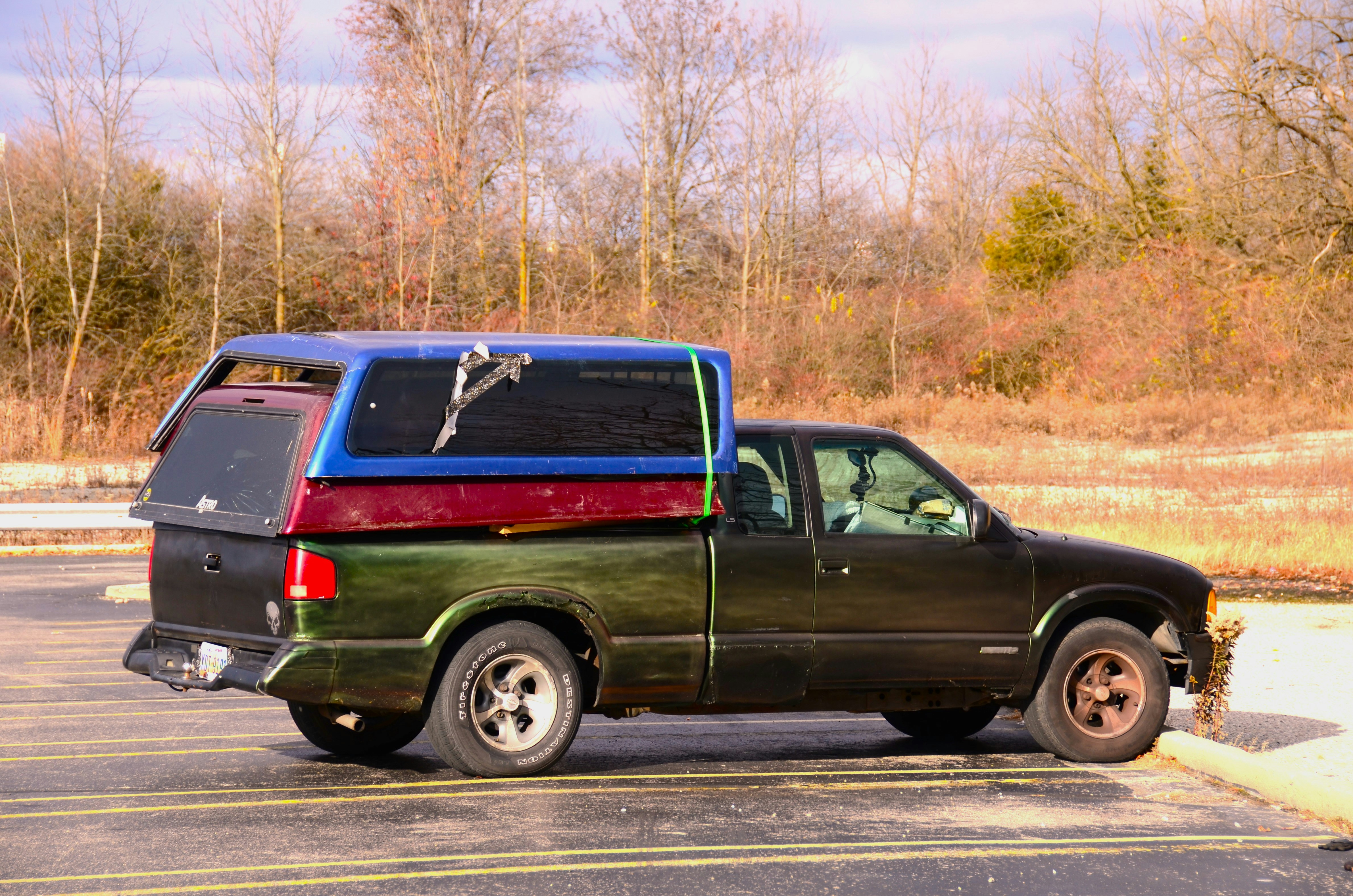 Workhorse on Wheels: The Long-Haul Pickup with a Colorful Camper