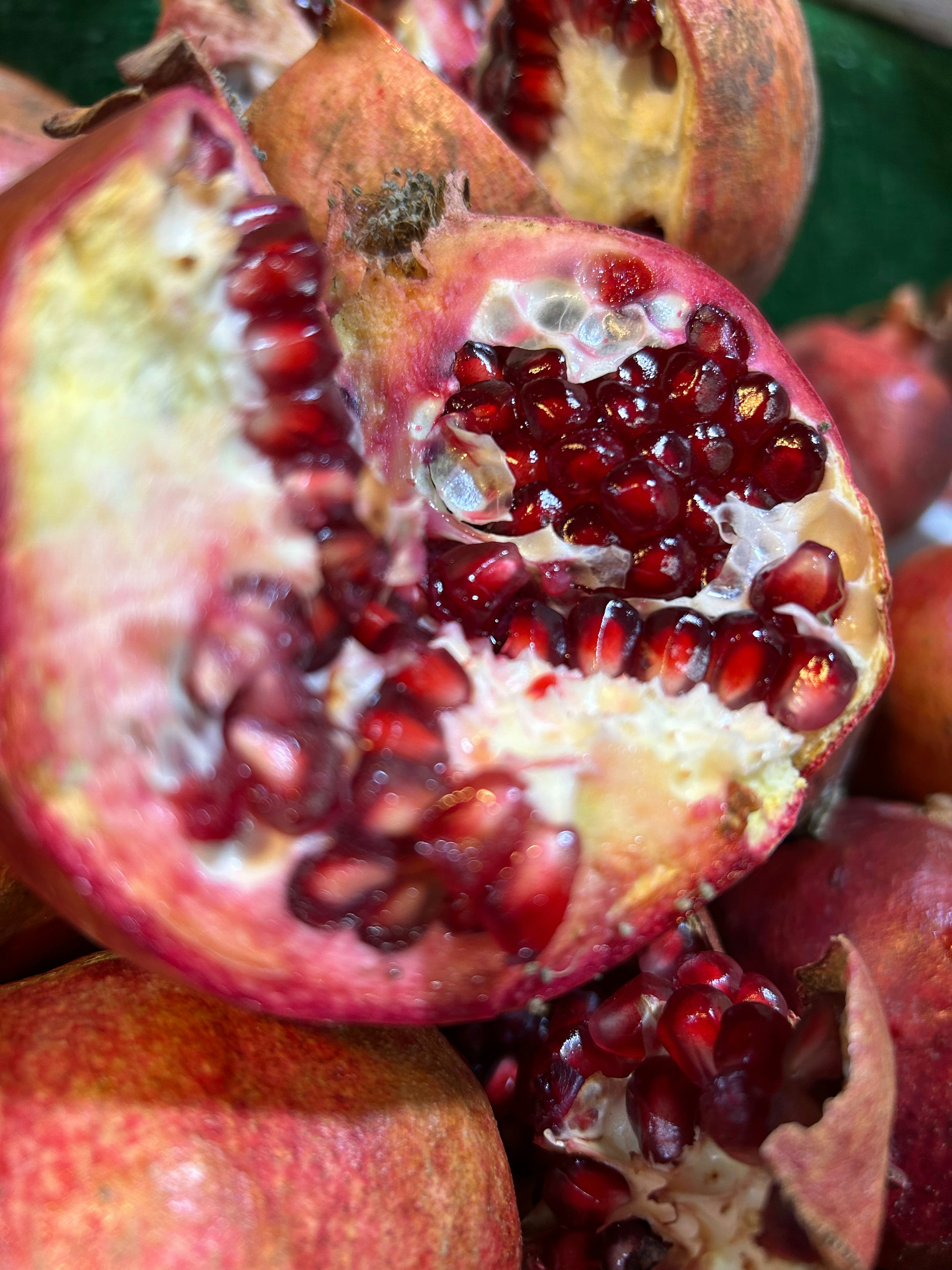 Juicy Crimson Quarters: A Pomegranate Burst in Macro Close-Up