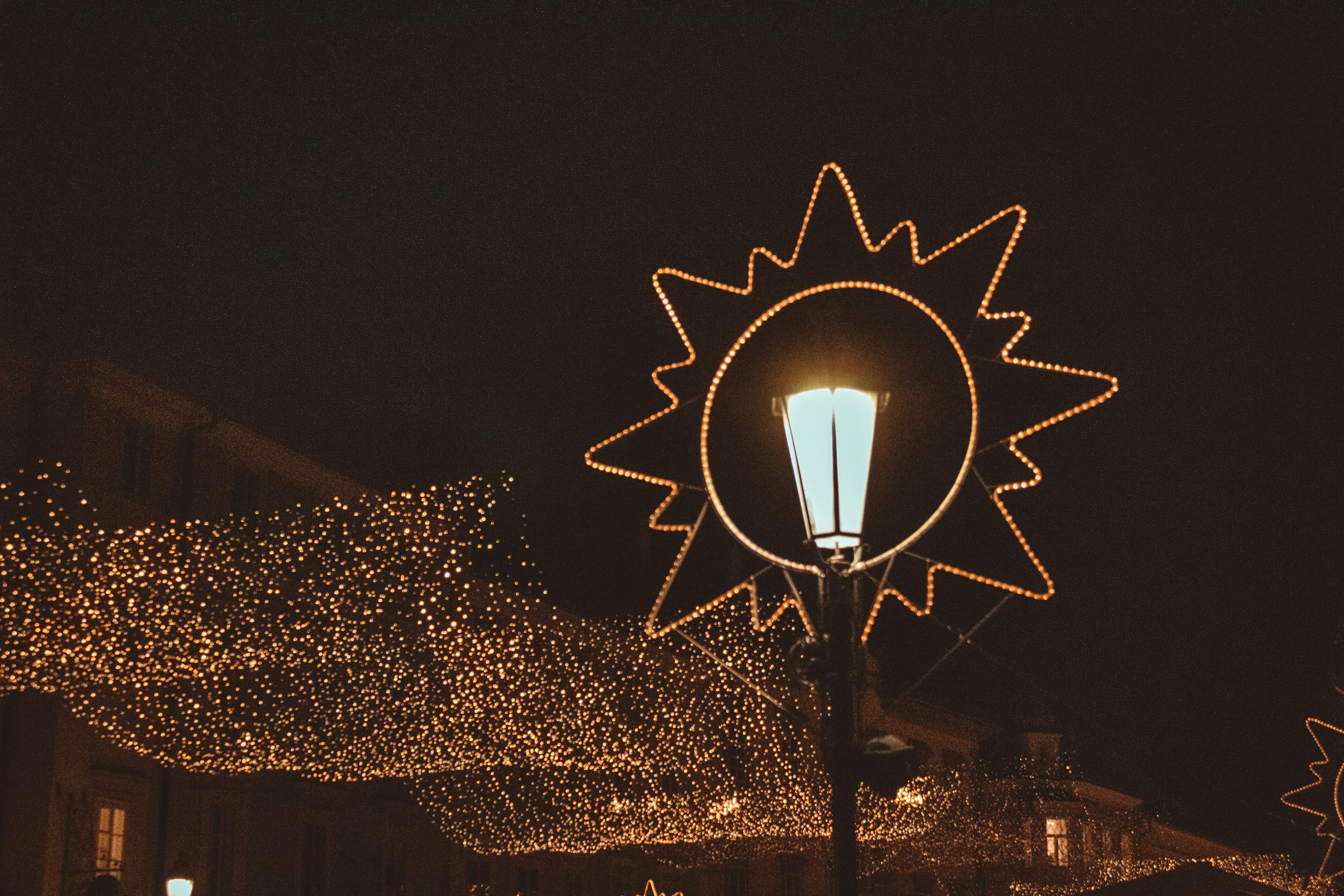 Haloed Lantern Amid Velvet Night: Festive Street Lights