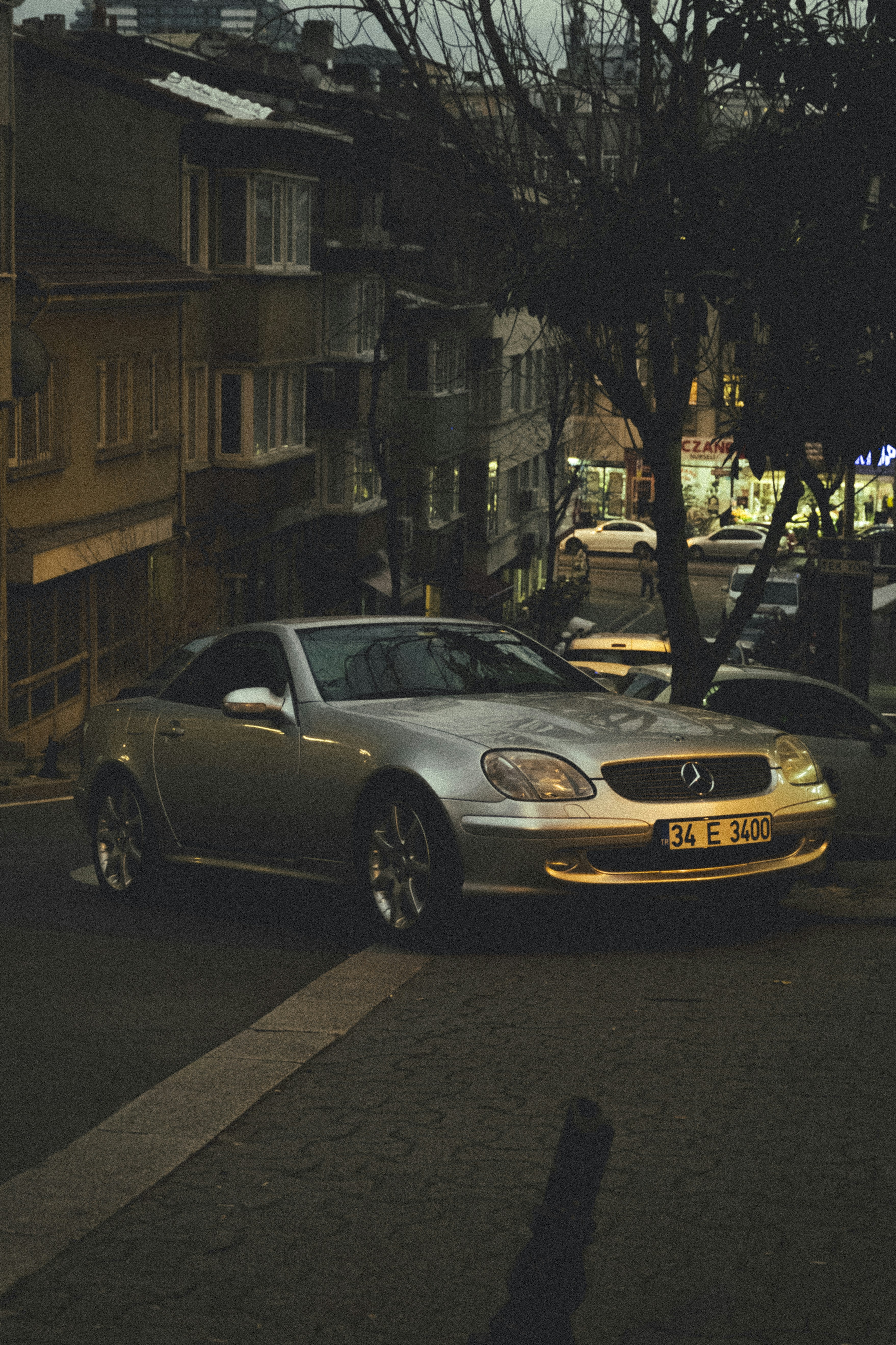 Istanbul Night: Silver Mercedes on a Narrow Lamp-lit Street