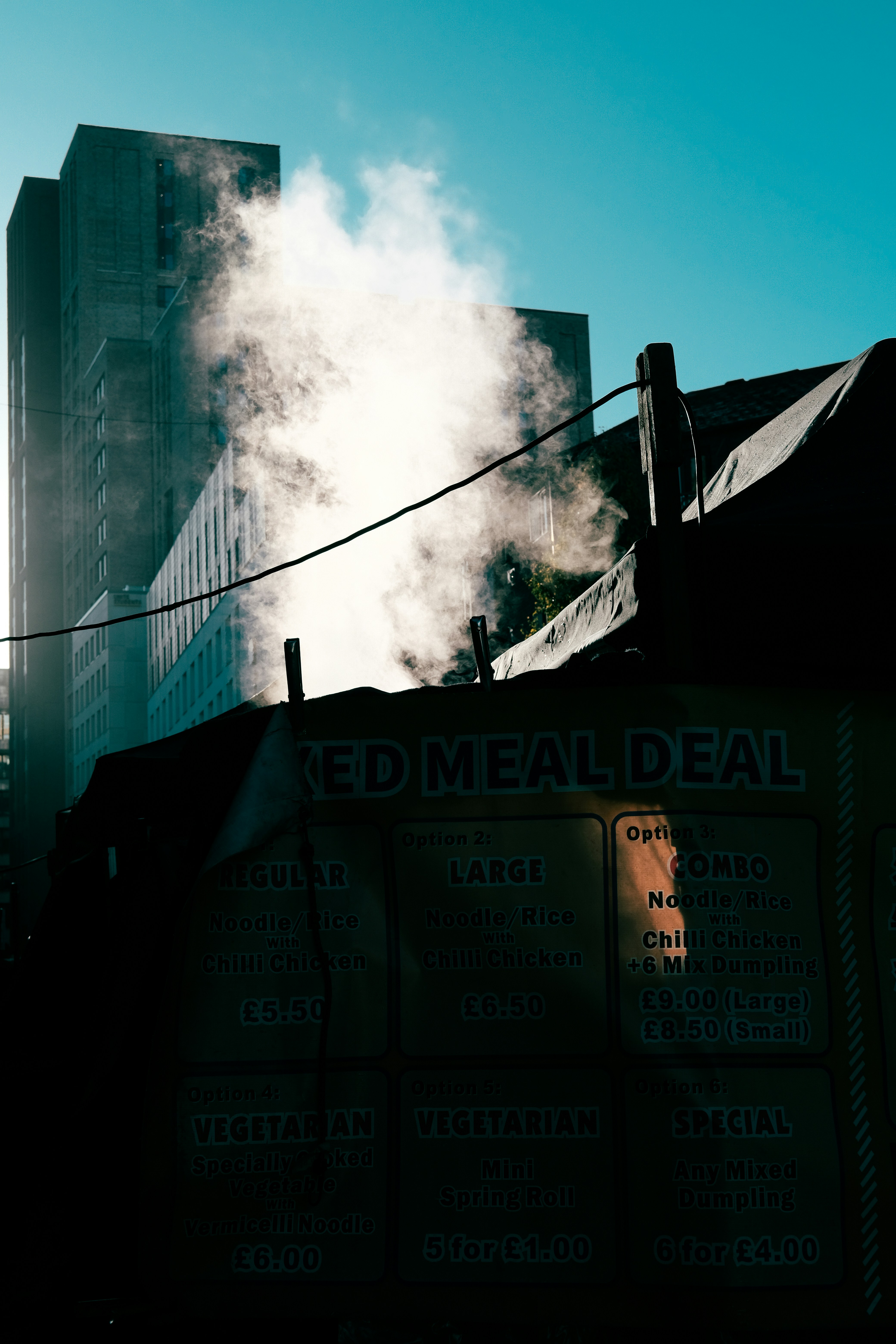 A building with a lot of smoke coming out of it photo – Free Aldgate ...