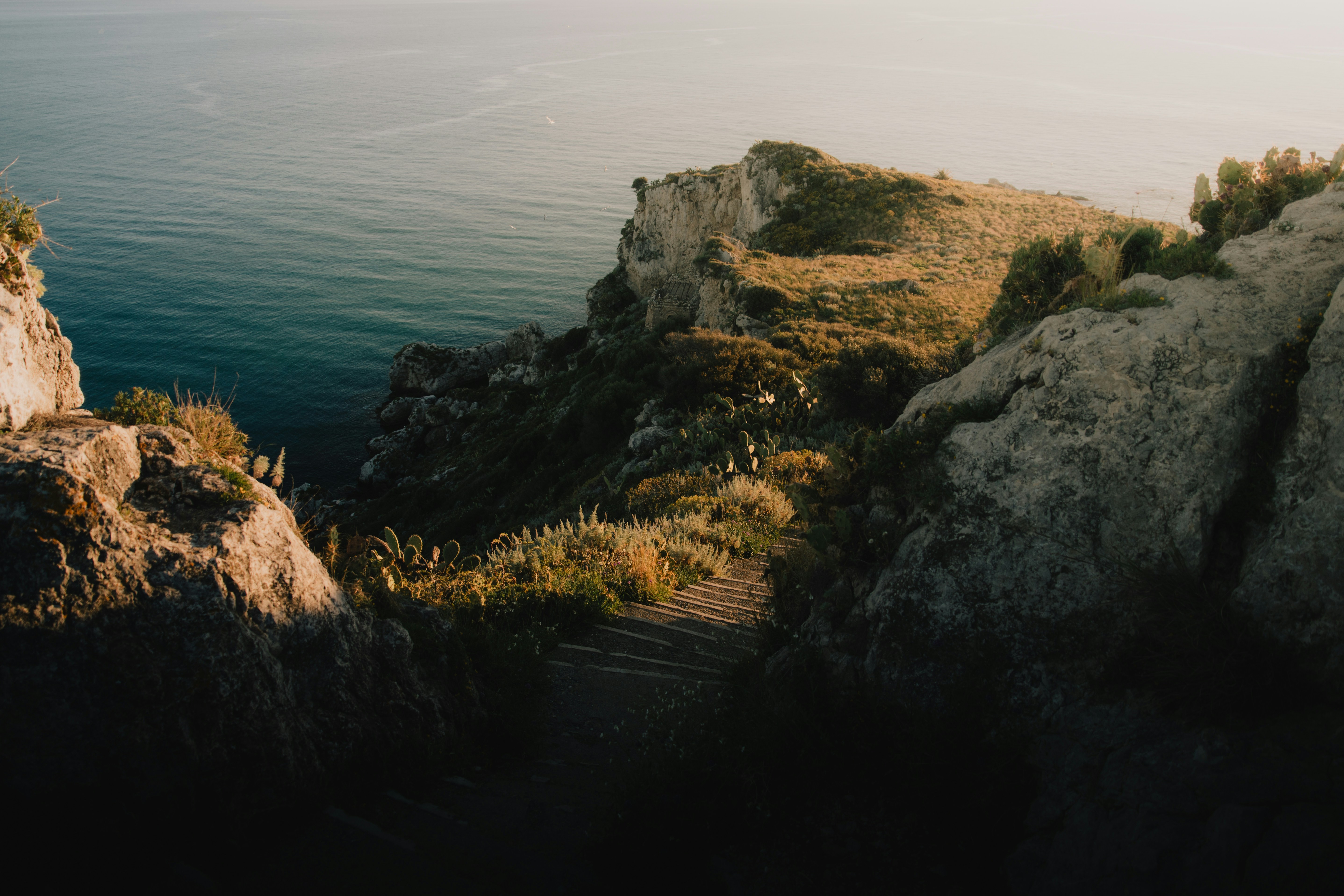 A view of the ocean from the top of a cliff photo – Free Capo milazzo ...