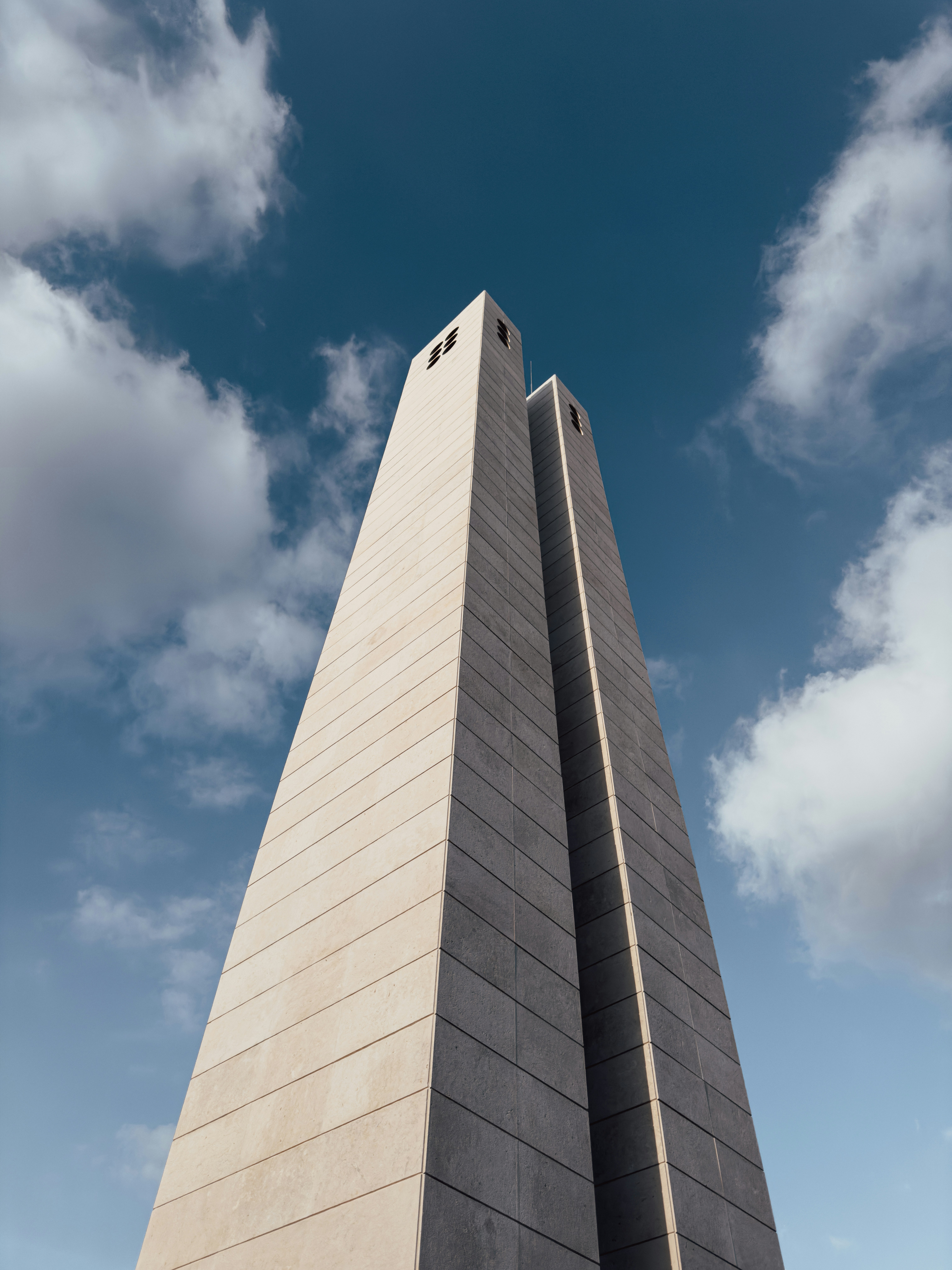 Twin Concrete Spires Toward a Cerulean Sky