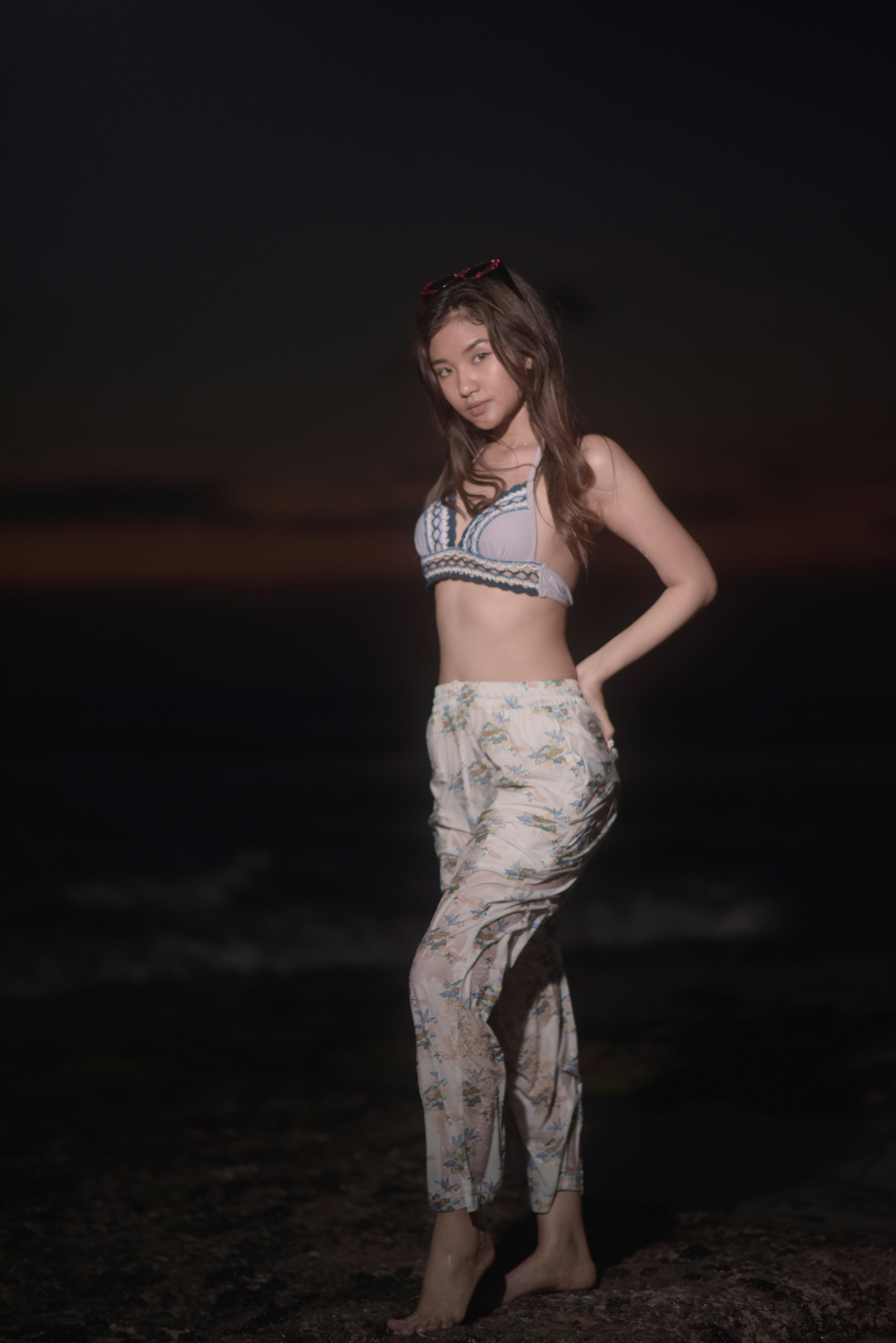 Twilight Pose: A Coastal Silhouette in Light Bohemia