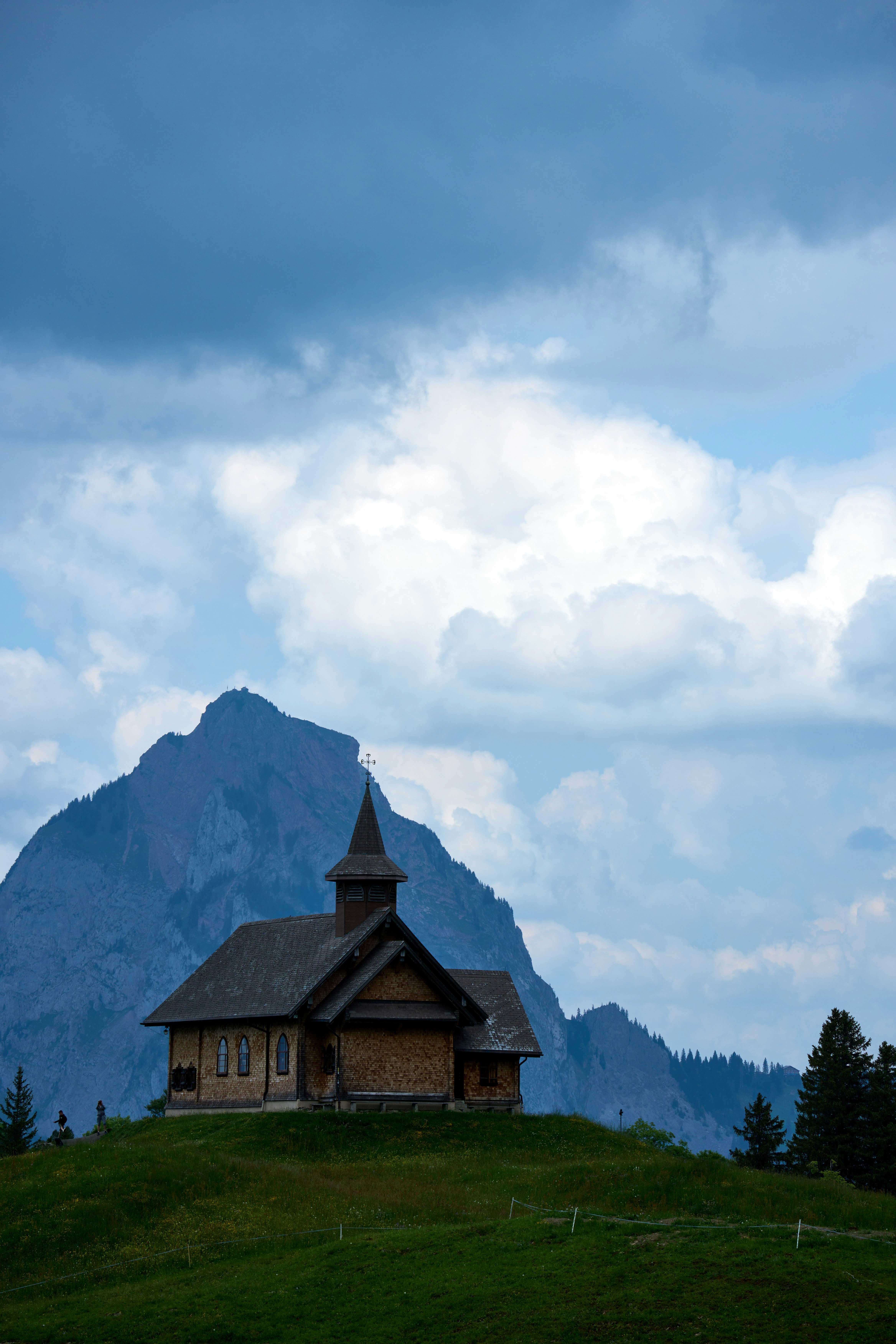 A church on a hill with a mountain in the background photo – Free ...