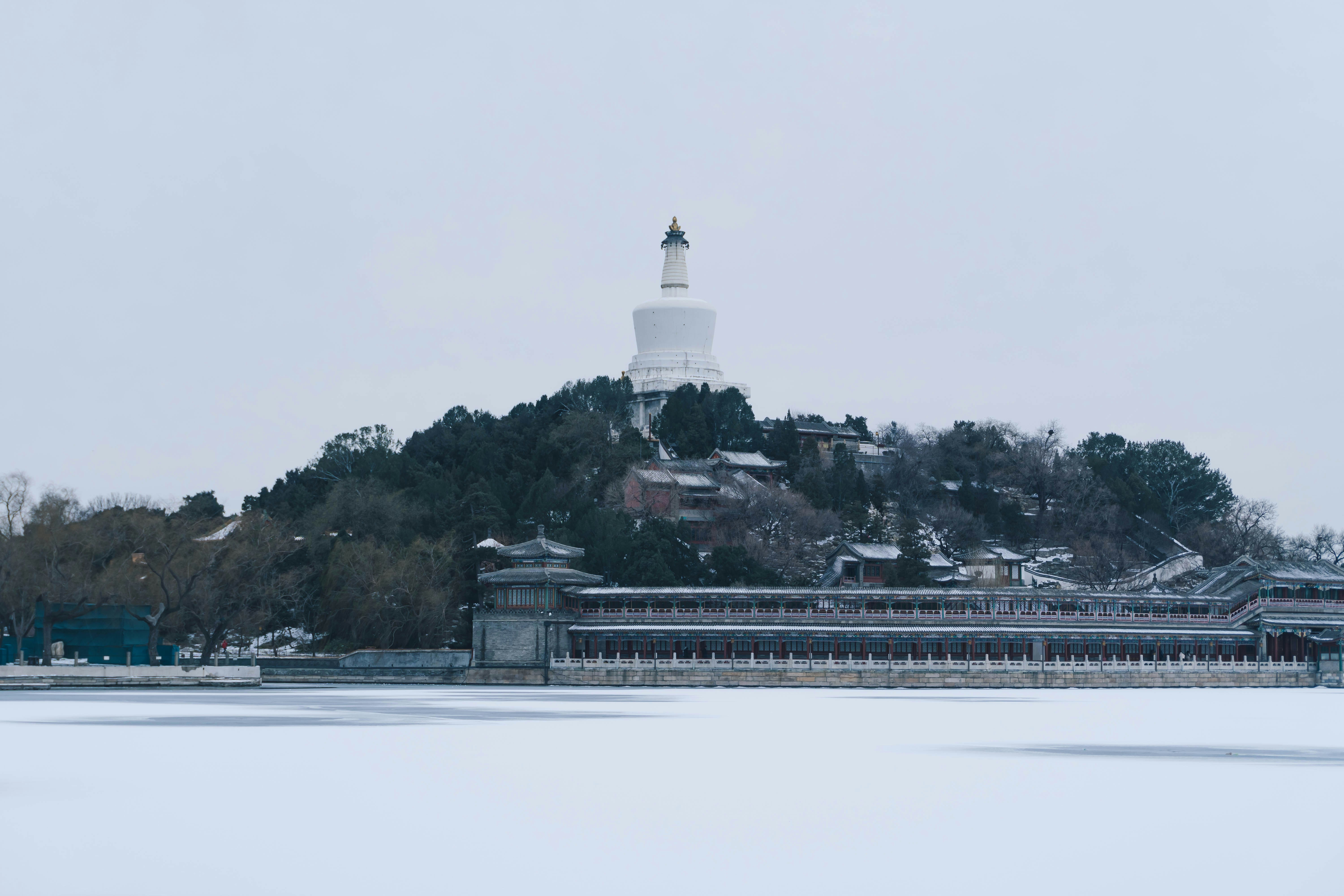 Snowbound Stupa on a Frosted Hill Overlooking a Frozen Waterfront