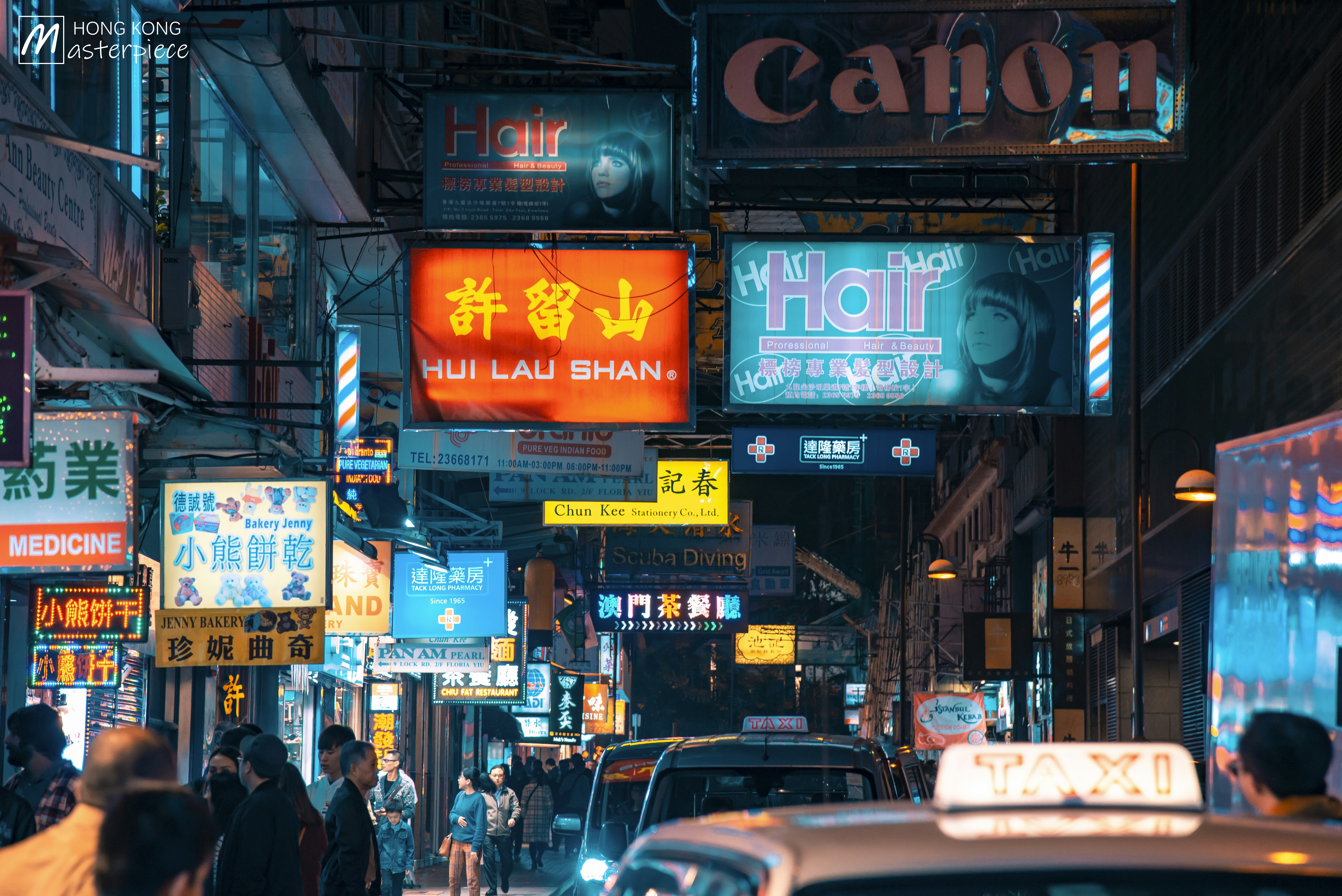 A busy city street filled with lots of neon signs photo – Free Tsim sha ...