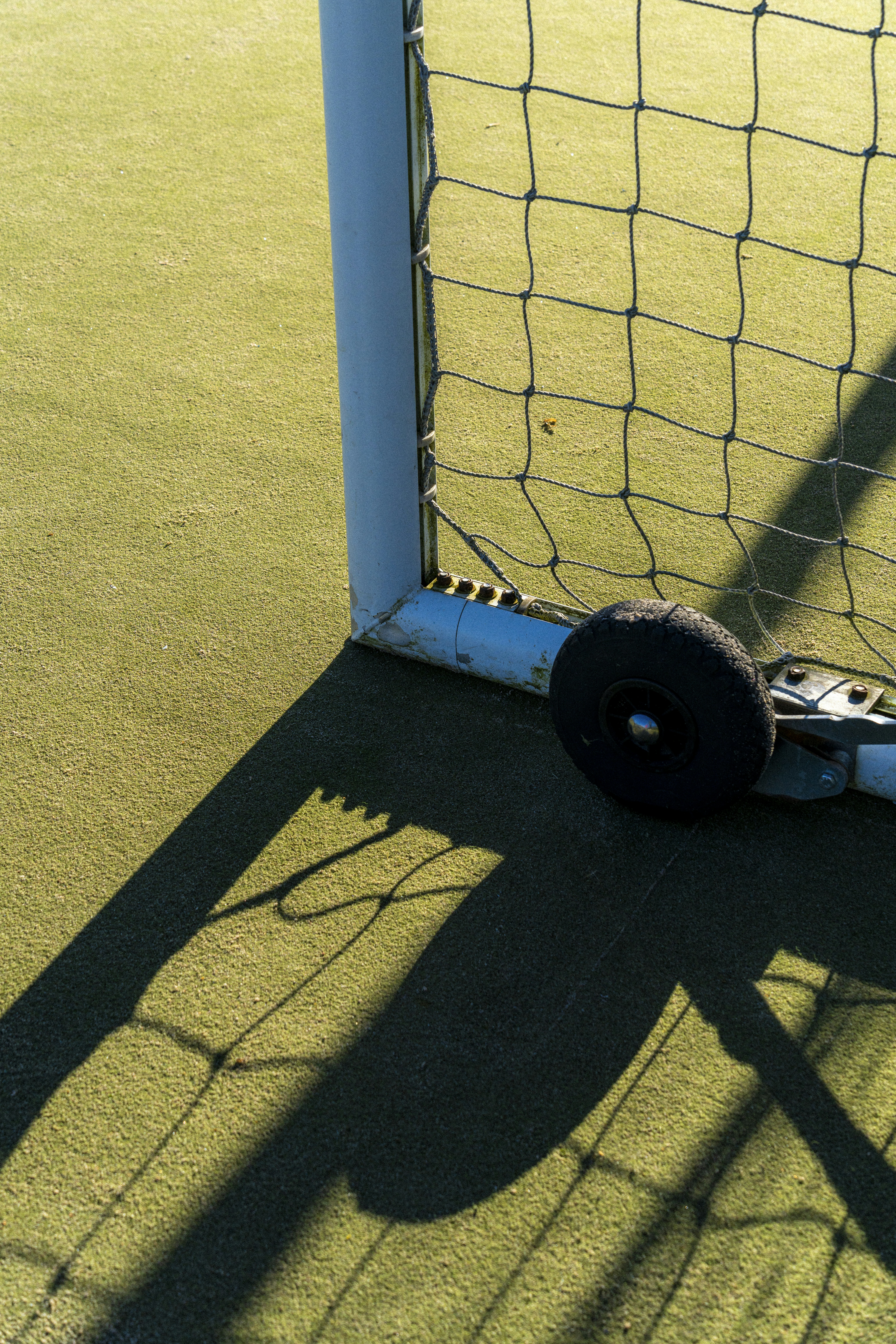 A soccer goal with a wheel attached to it photo – Free Uk Image on Unsplash