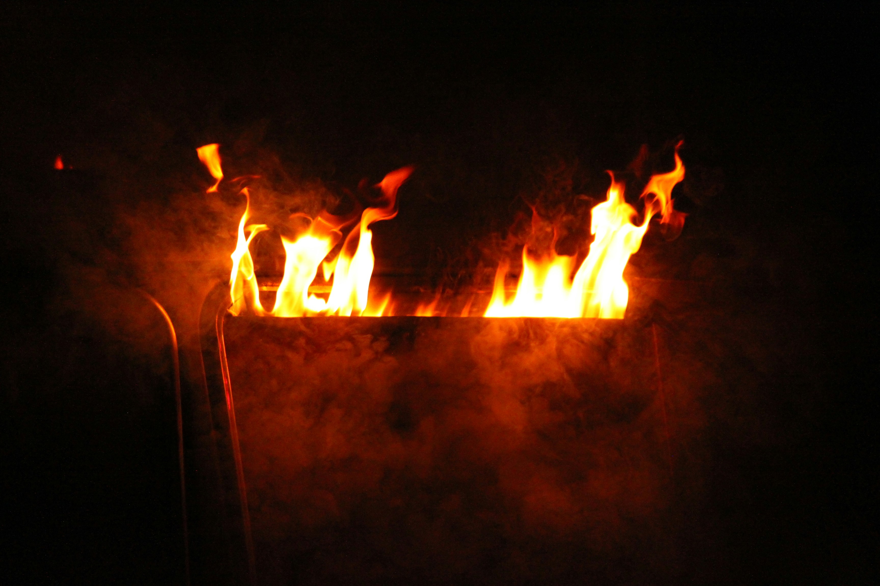 A fire is lit up in the dark photo – Free Fire Image on Unsplash