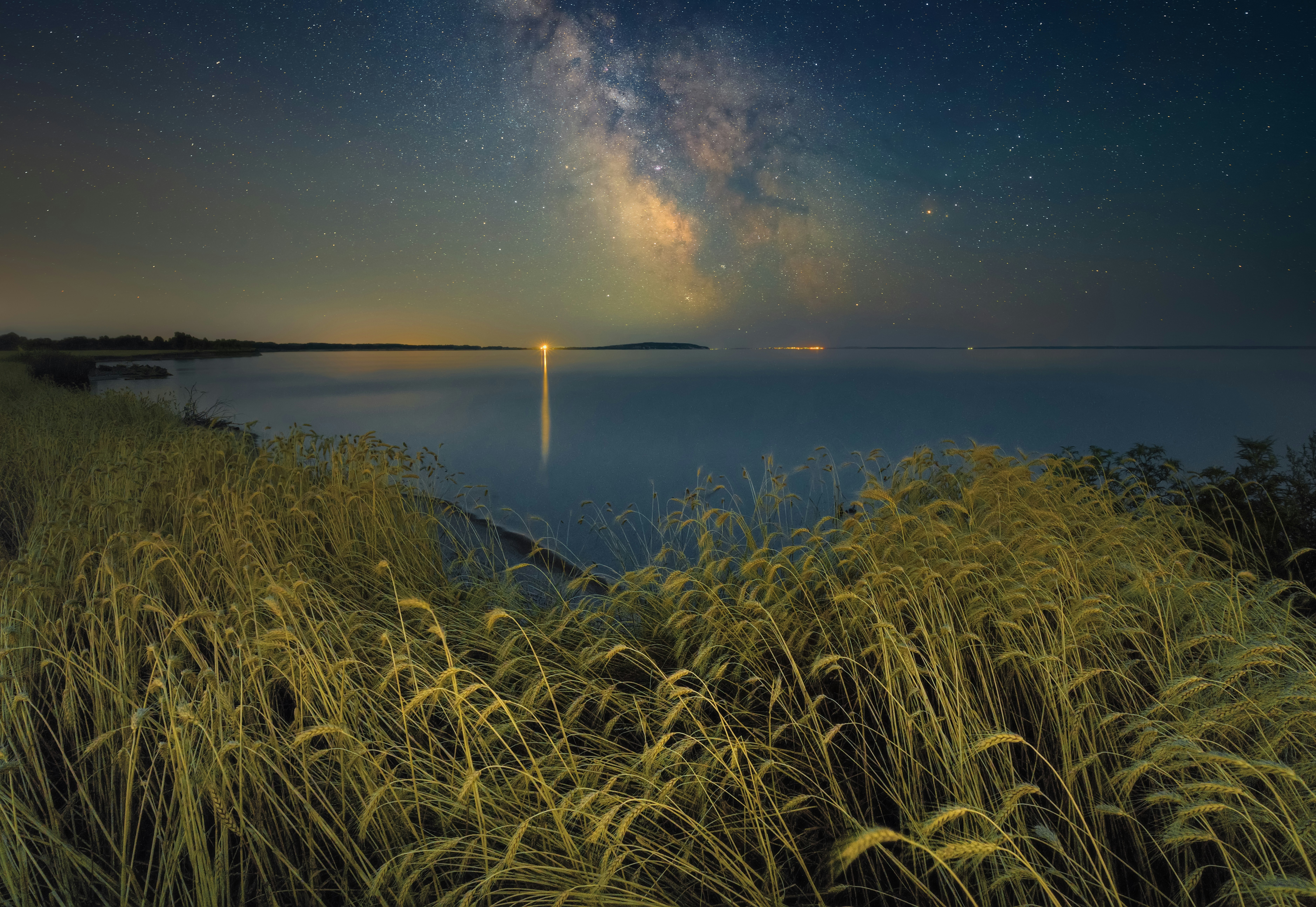 The night sky over a body of water photo – Free Sky Image on Unsplash