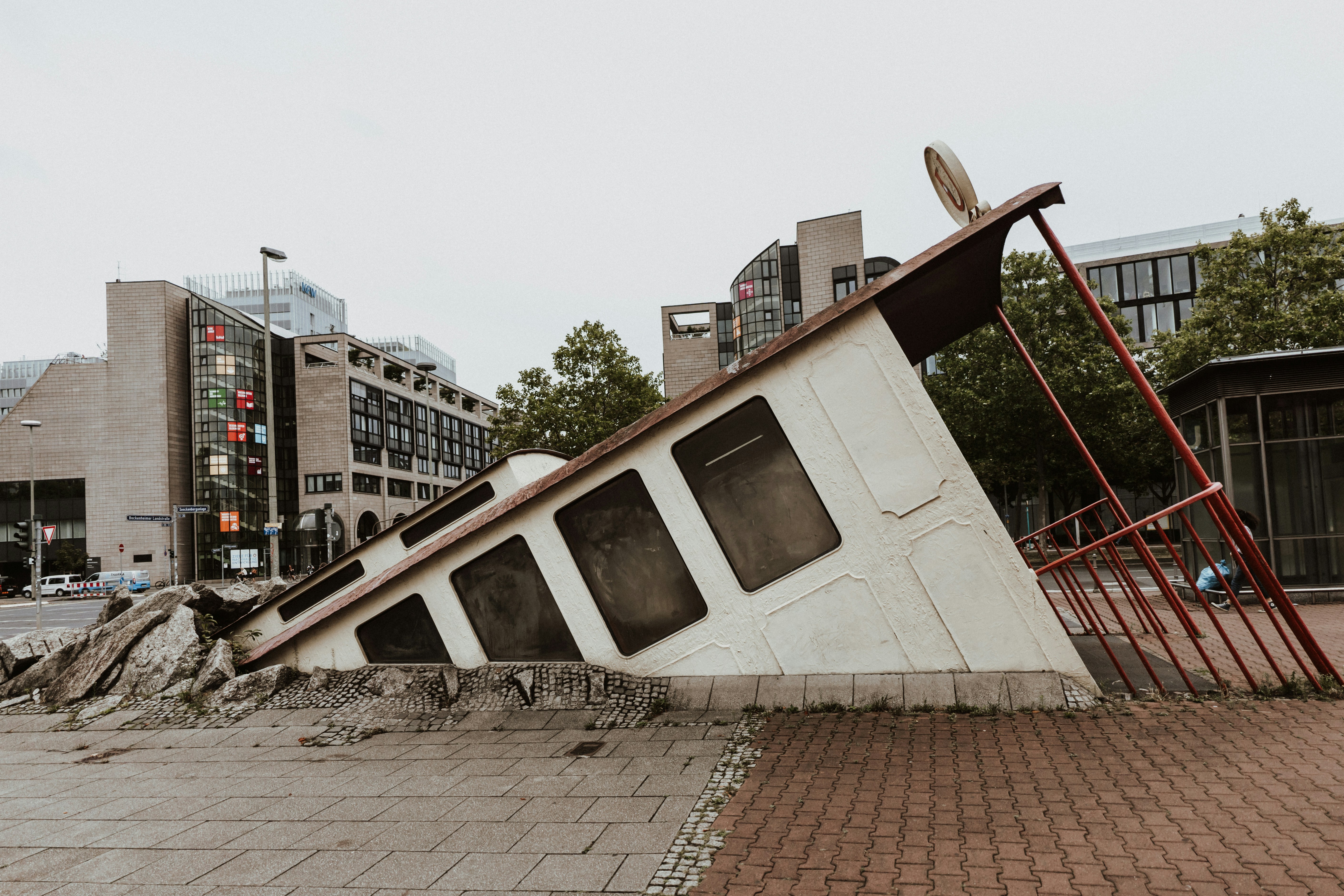 A building that has been knocked over with a ladder photo – Free Car ...