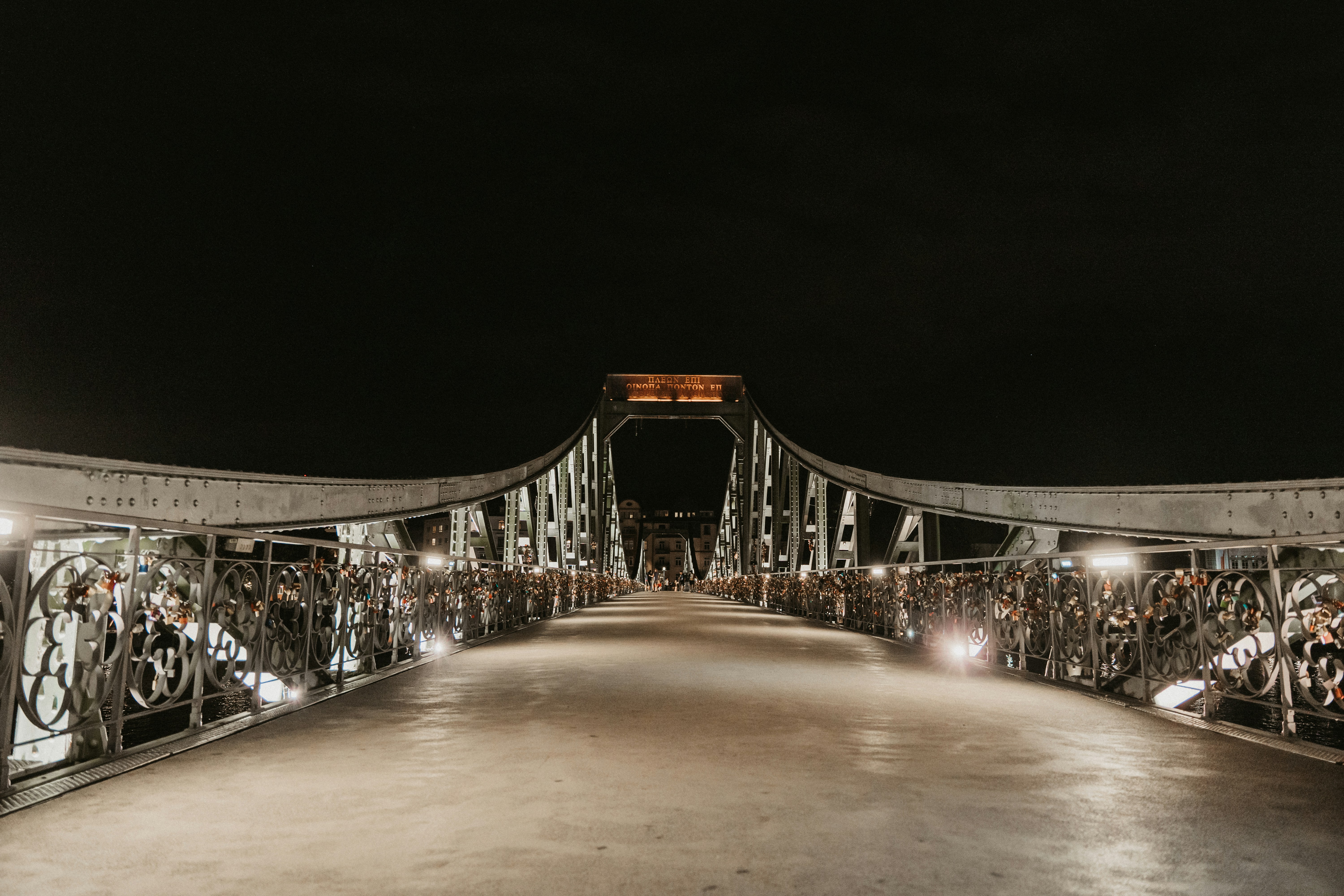 A very long bridge with lots of bikes on it photo – Free Arched Image ...