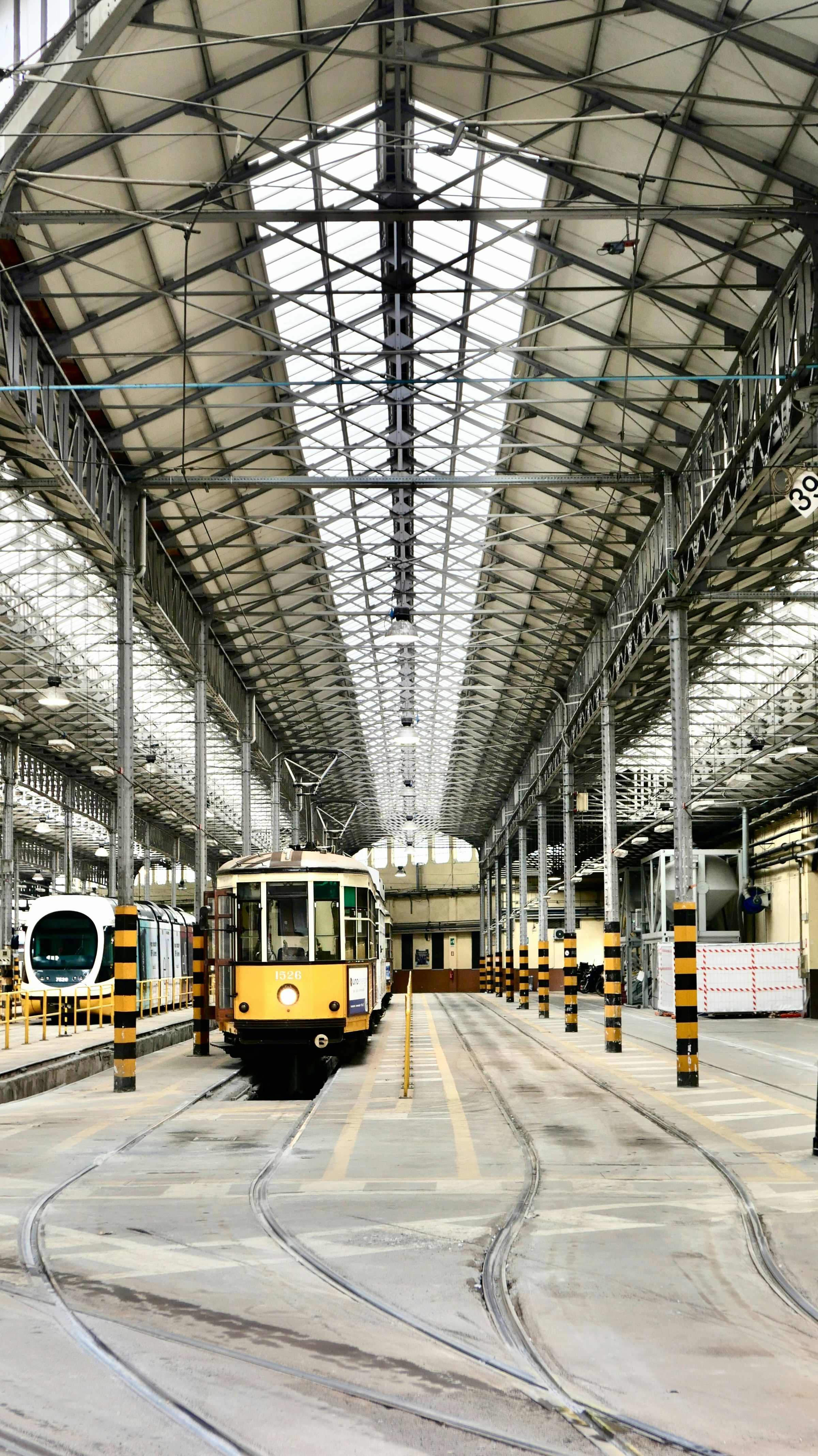 Amber Tram Under a Glass-Lit Steel Cathedral
