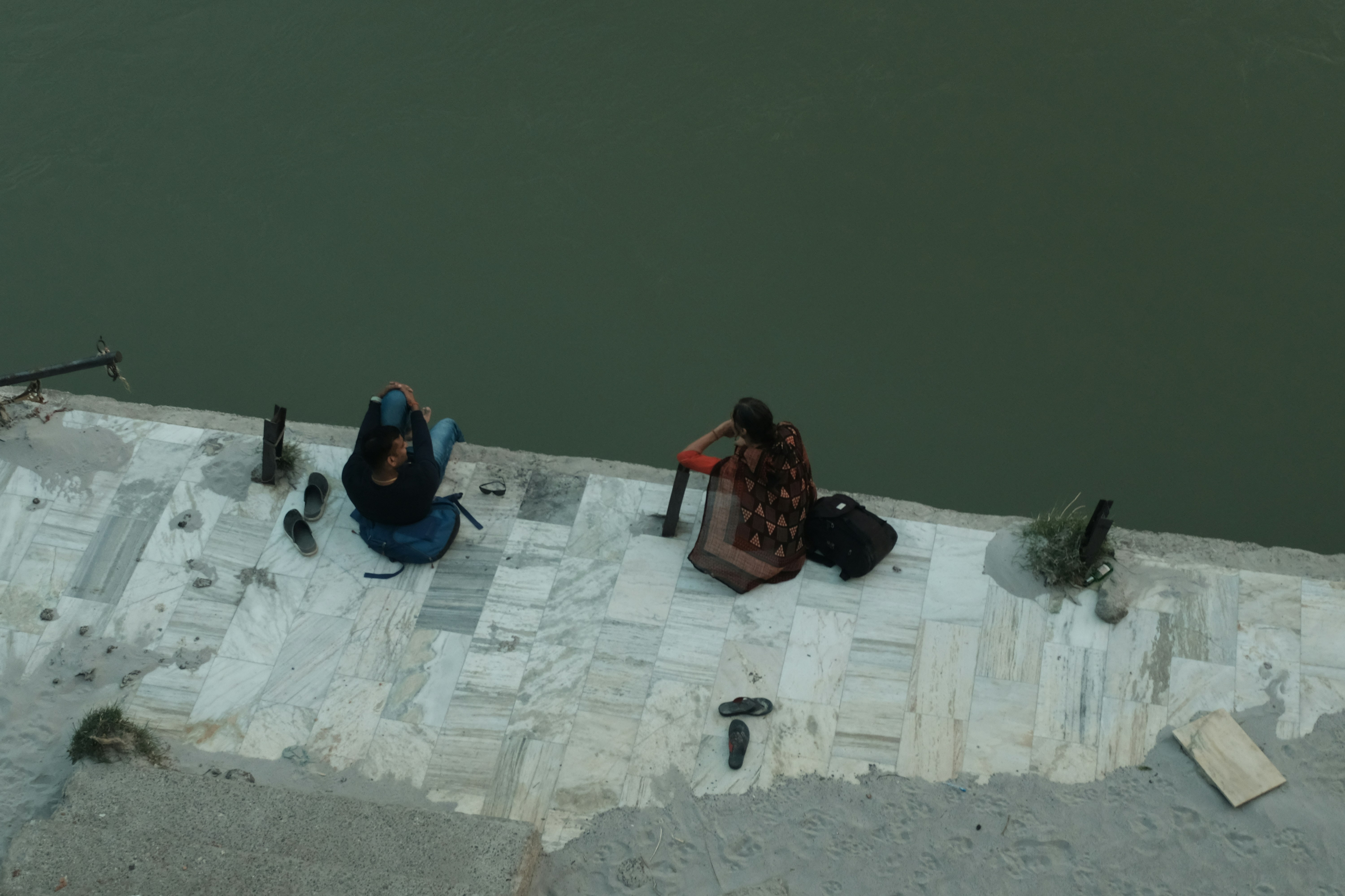 Two Figures at the Marble Embankment: A Quiet Balcony Over the River