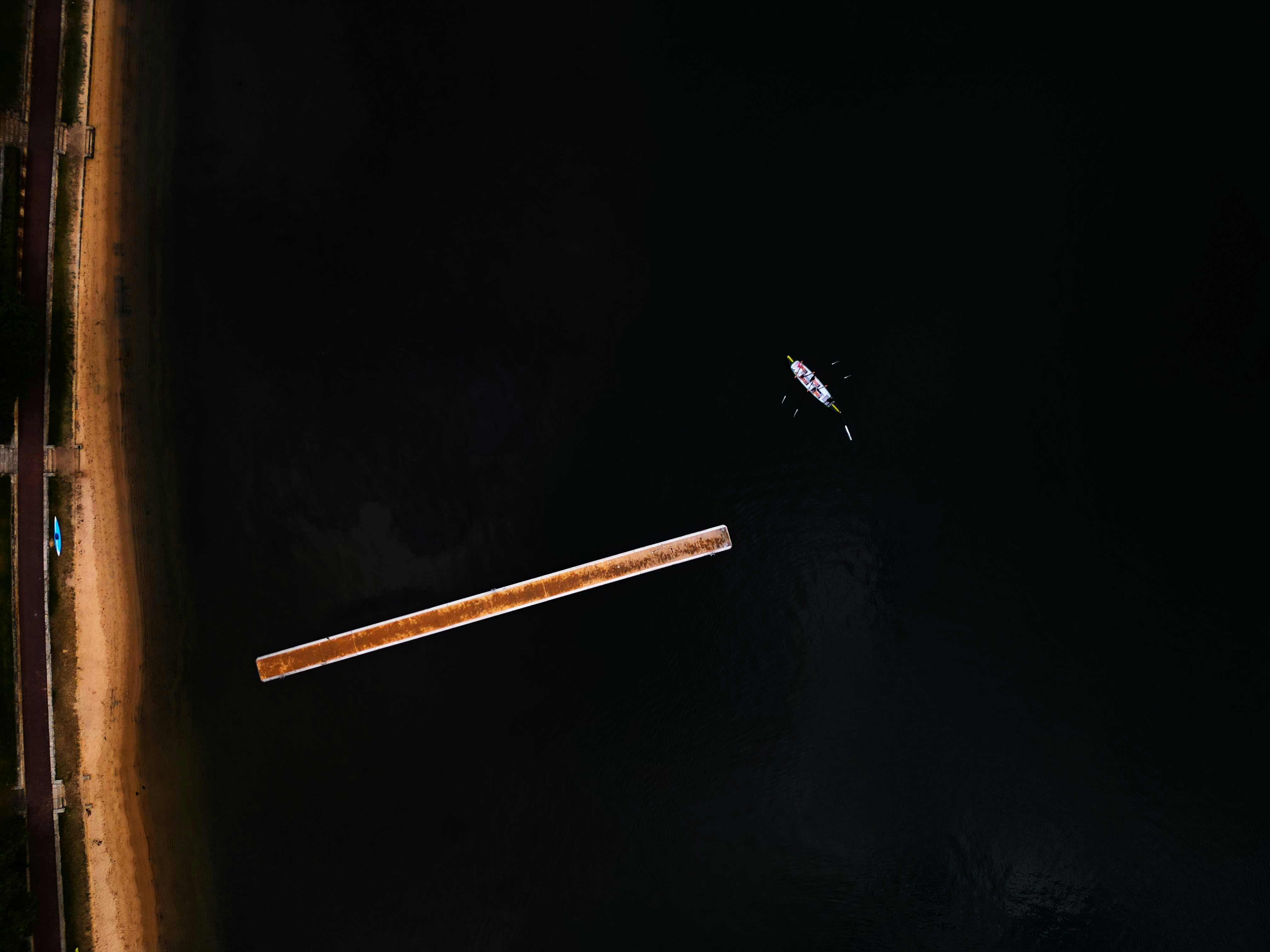 A boat floating on top of a body of water photo – Free Perth Image on ...