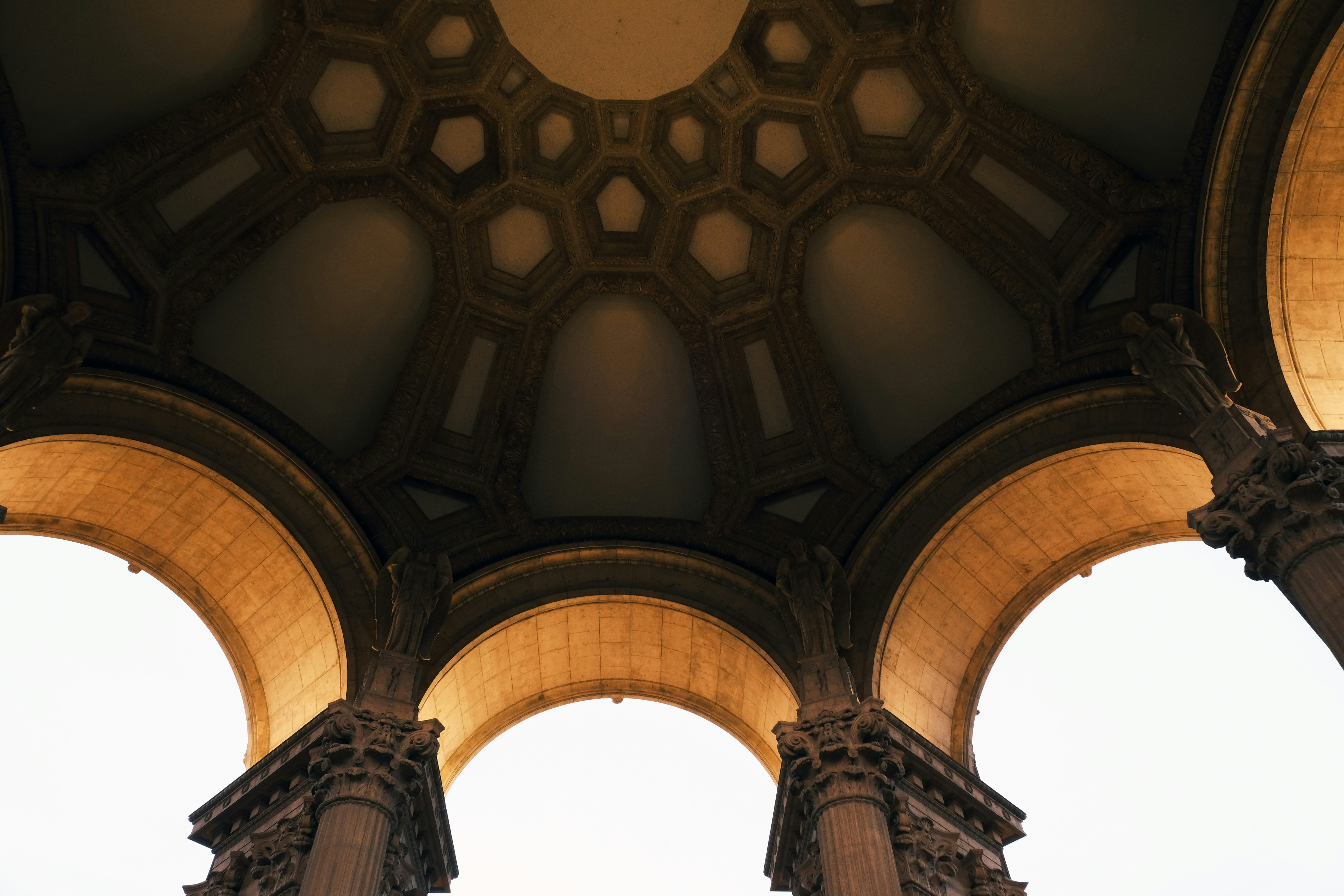 The ceiling of a building with arches and pillars photo – Free Building ...
