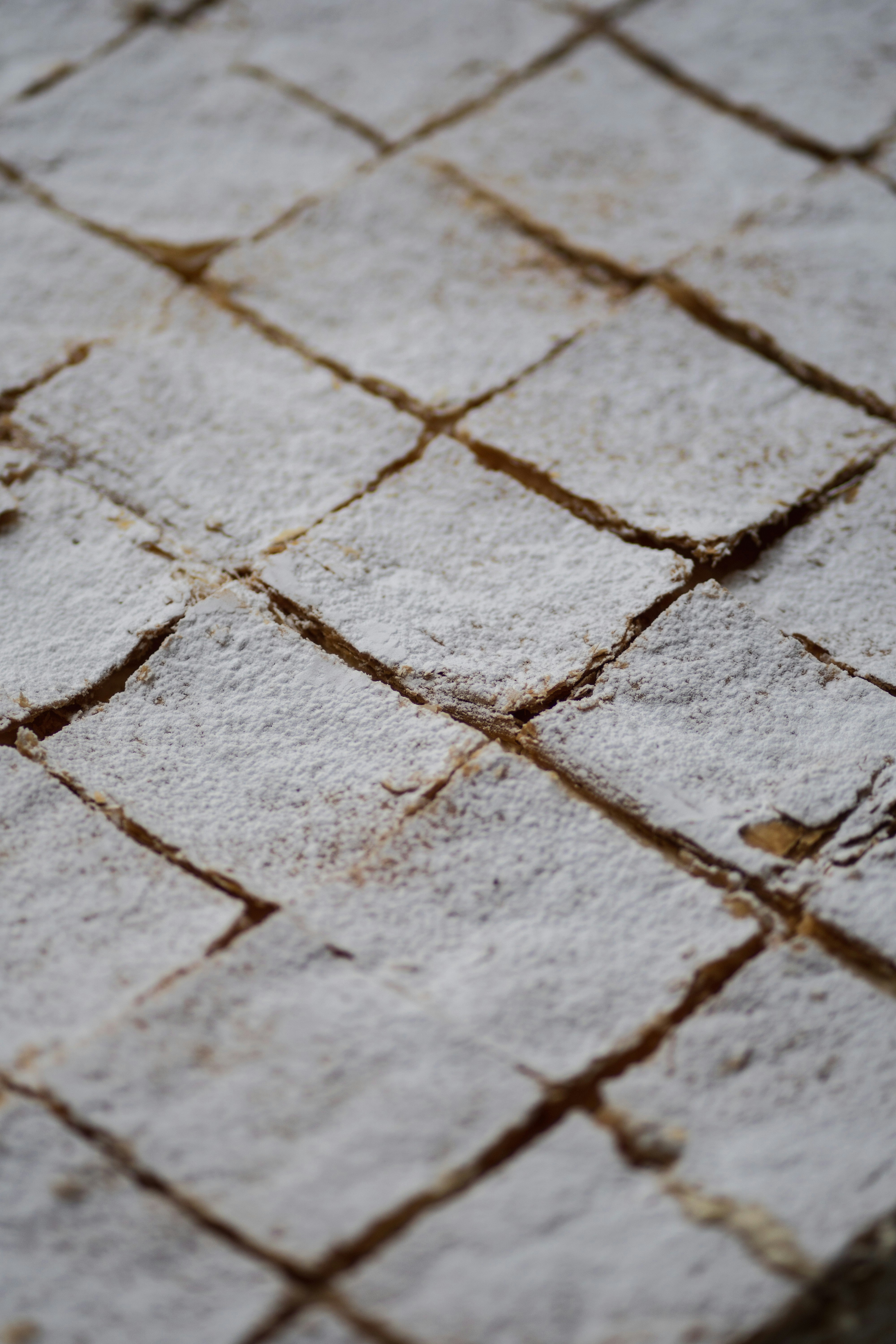 Powder-Dusted Cobblestone Grid Under Soft, Diagonal Light
