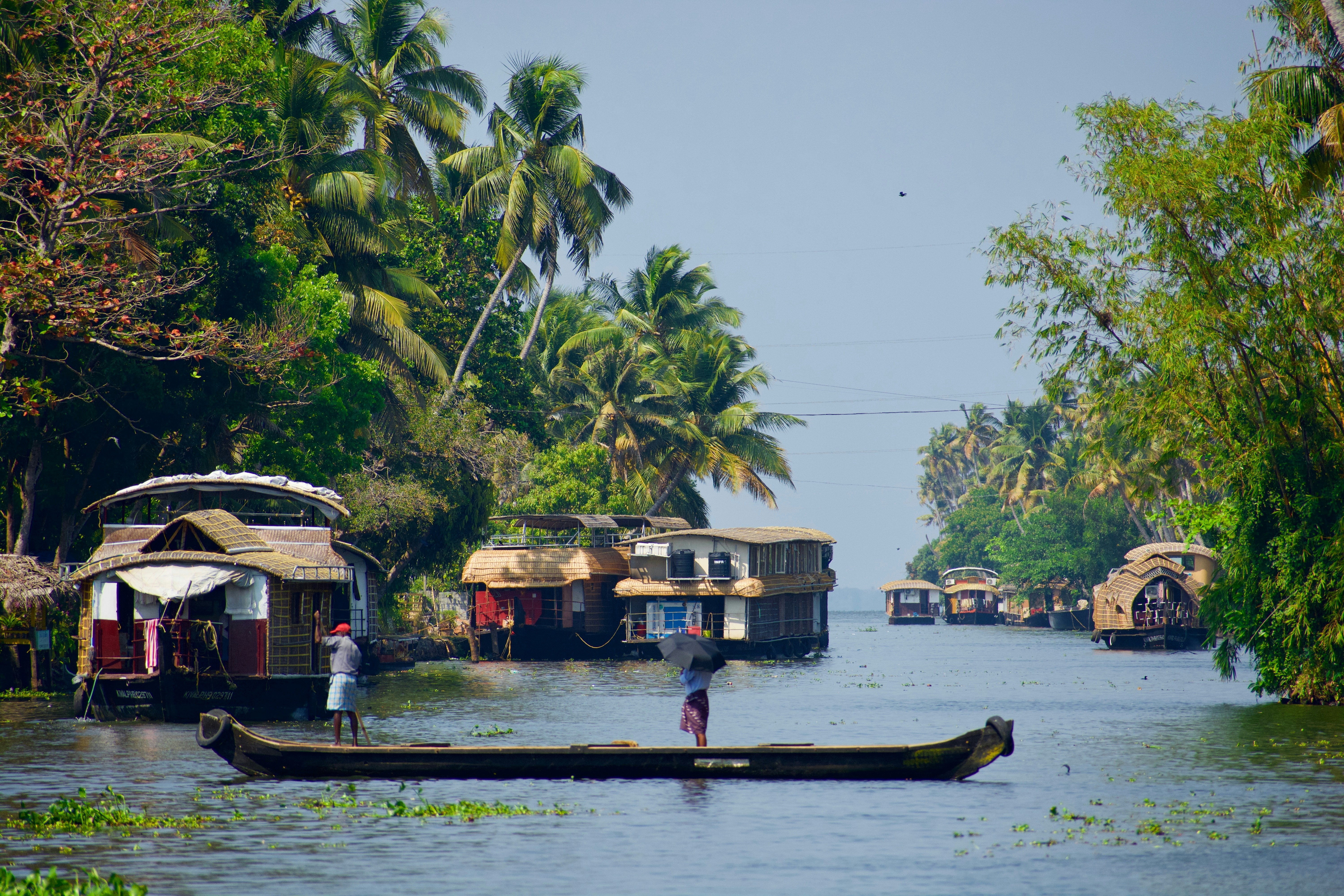 a person standing in a boat on a river