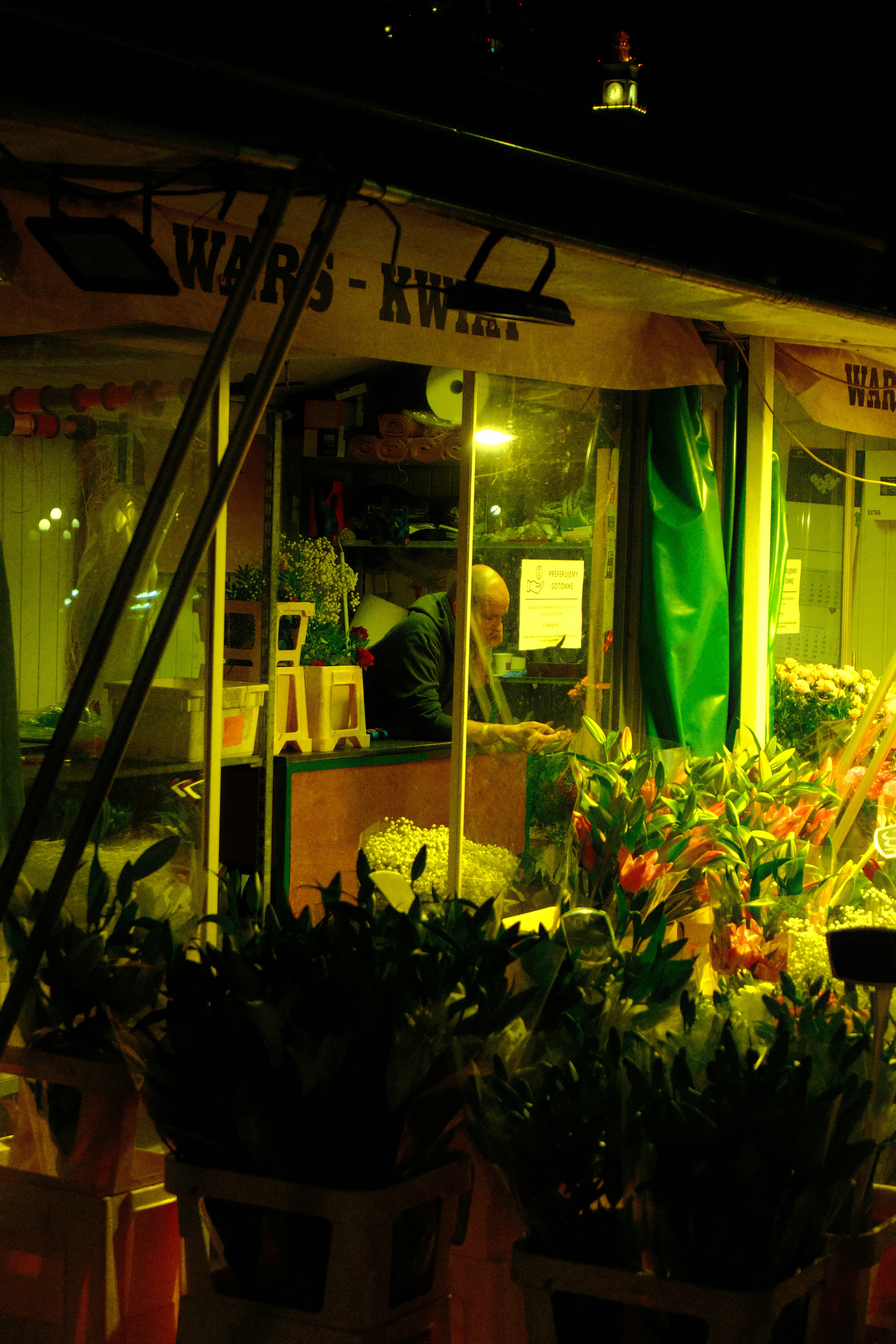 Neon-Gold Florist Stall: A Quiet Night Shift Amid Fresh Blooms