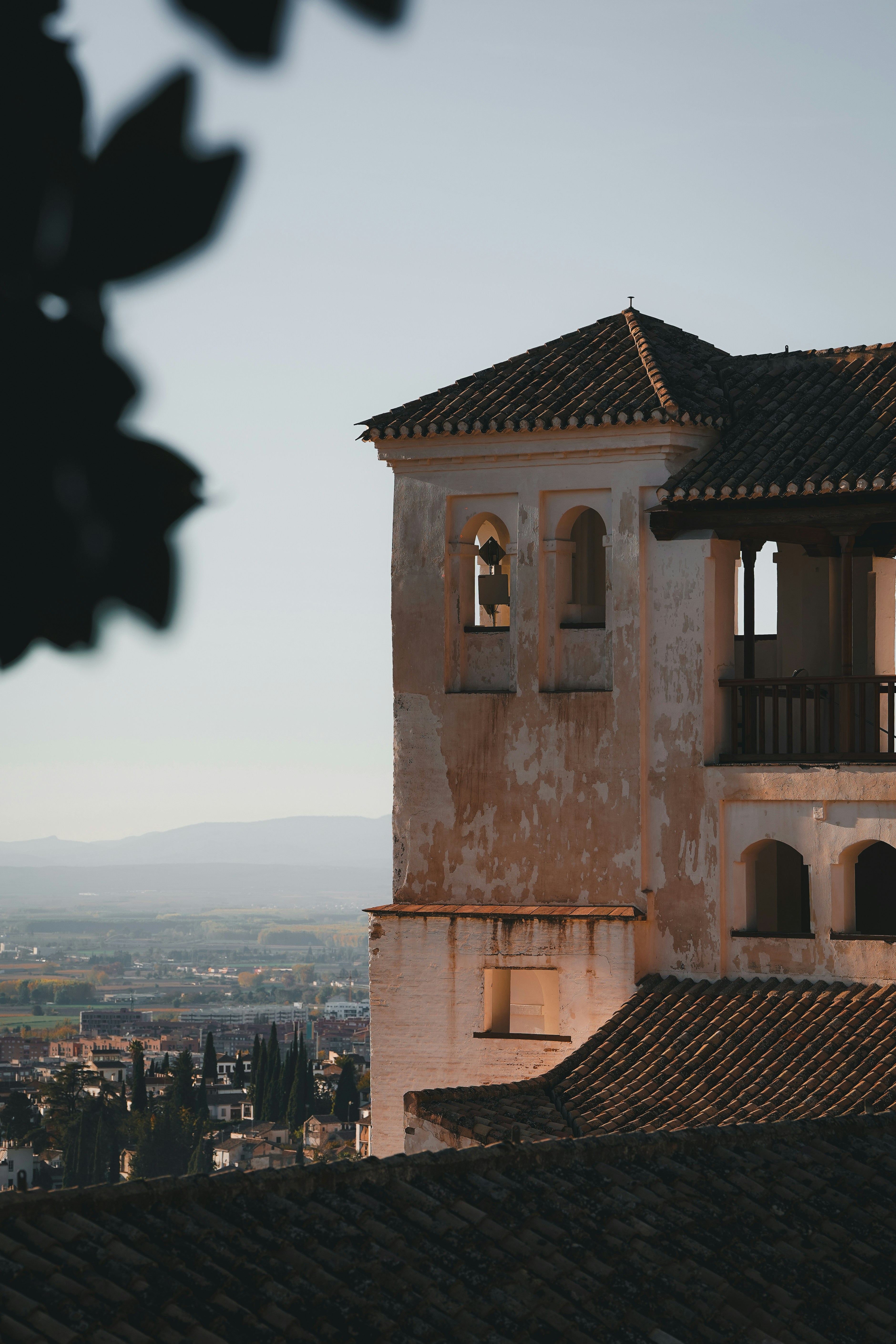 A tall building with a clock tower on top of it photo – Free Grenada ...