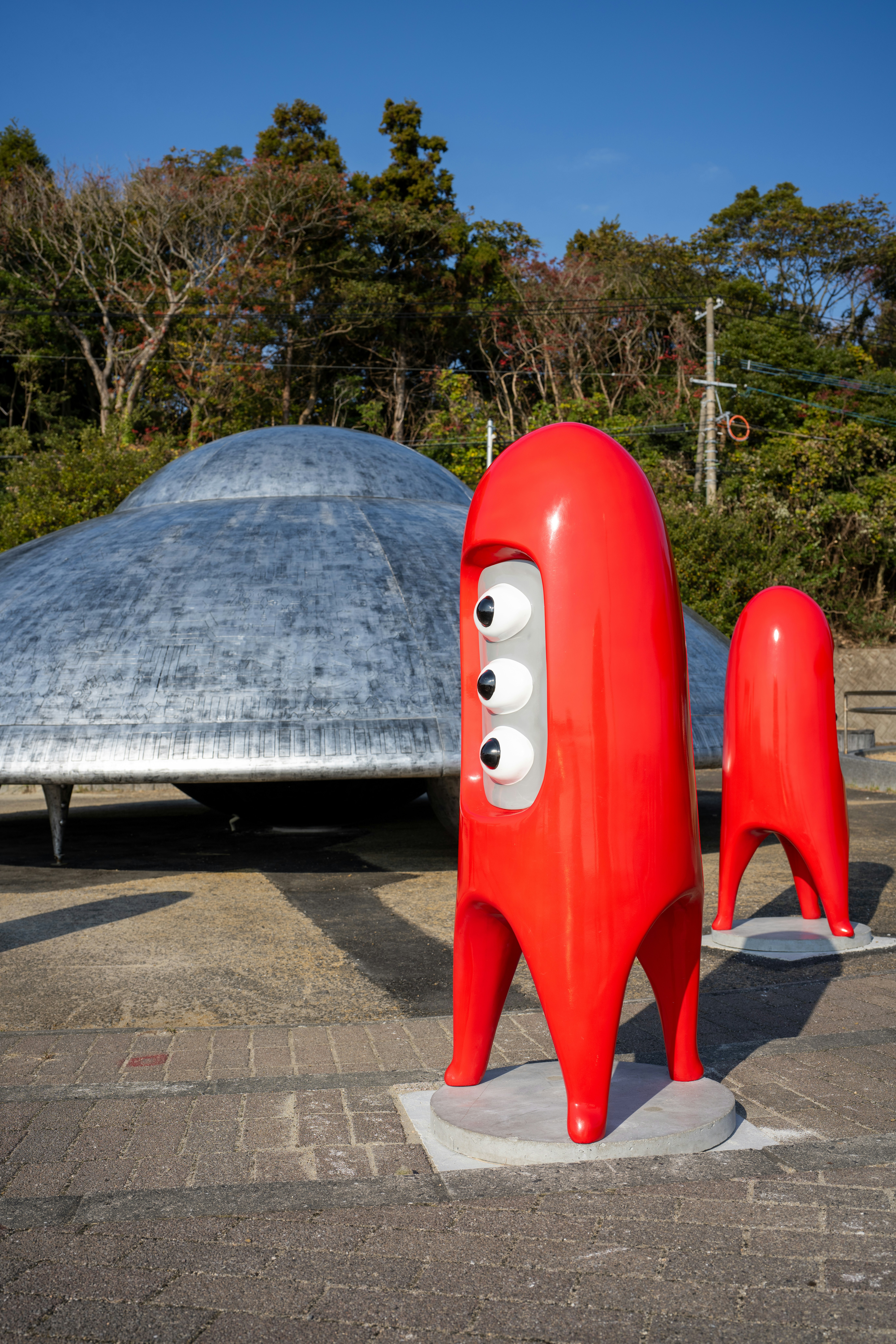 A large red object with two eyes on it photo – Free Shelter Image on ...