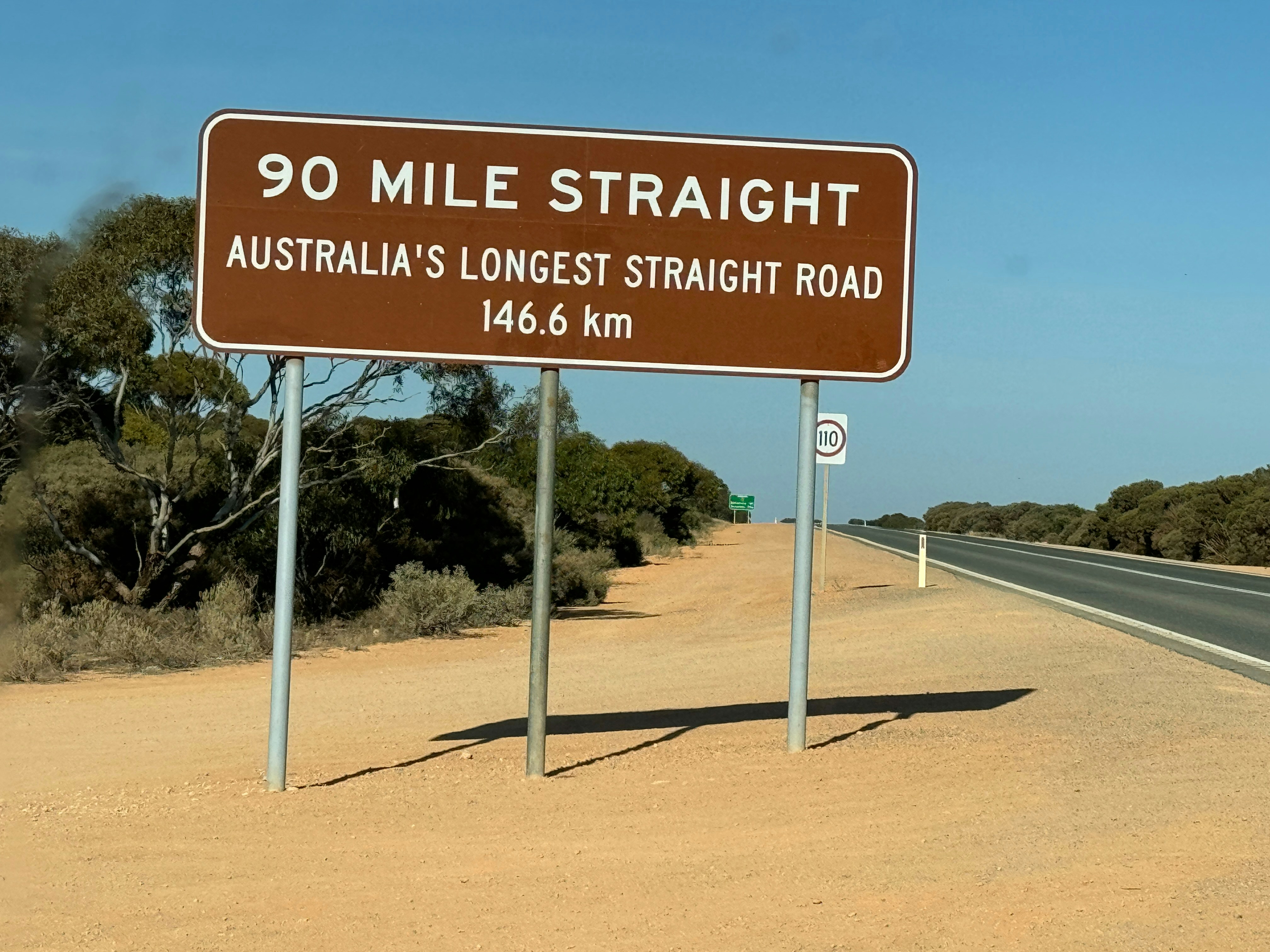 A sign on the side of a road that says 90 mile straight photo – Free ...