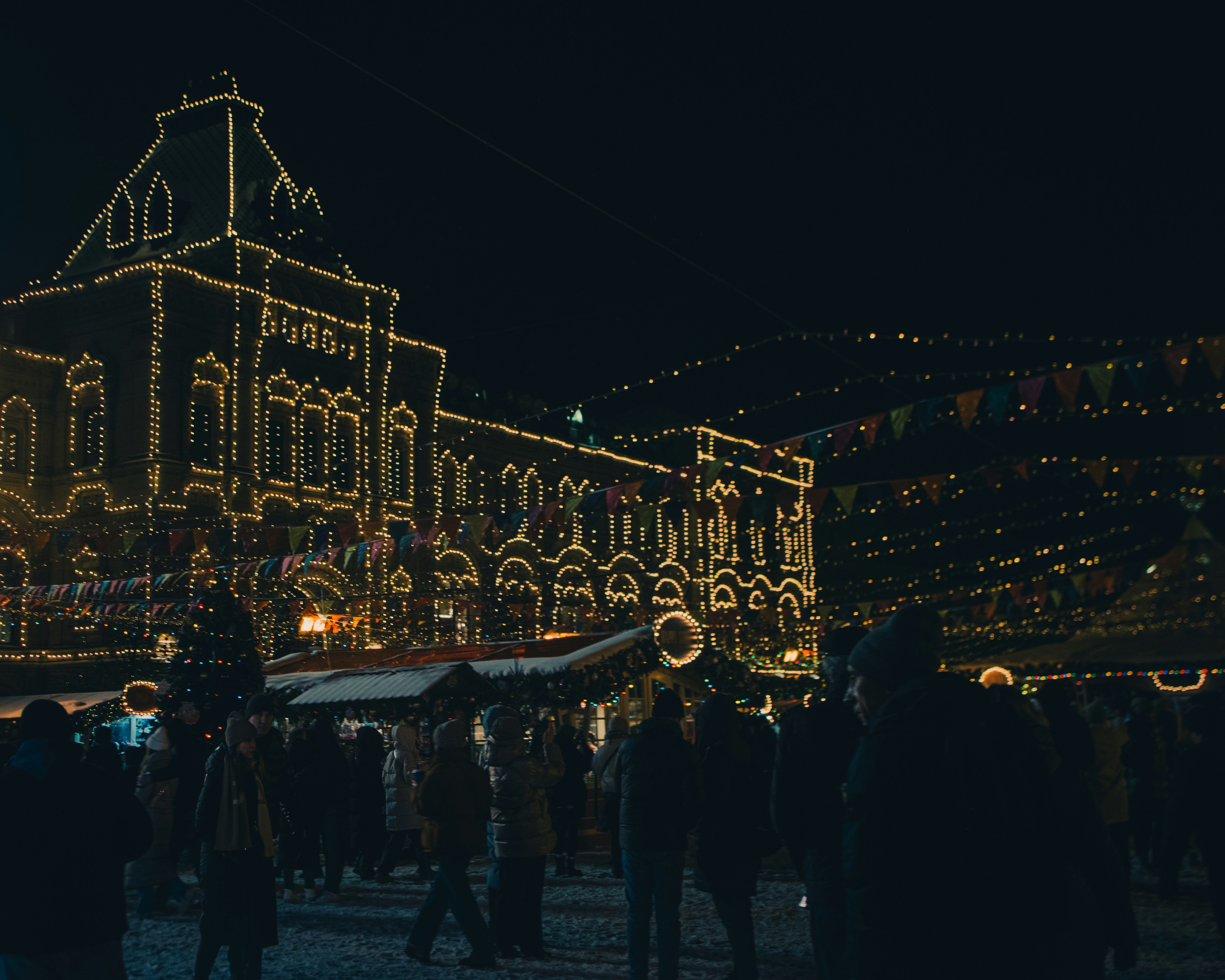 Luminous Facade Parade: Night Market Beneath a Canopy of Warm Lights