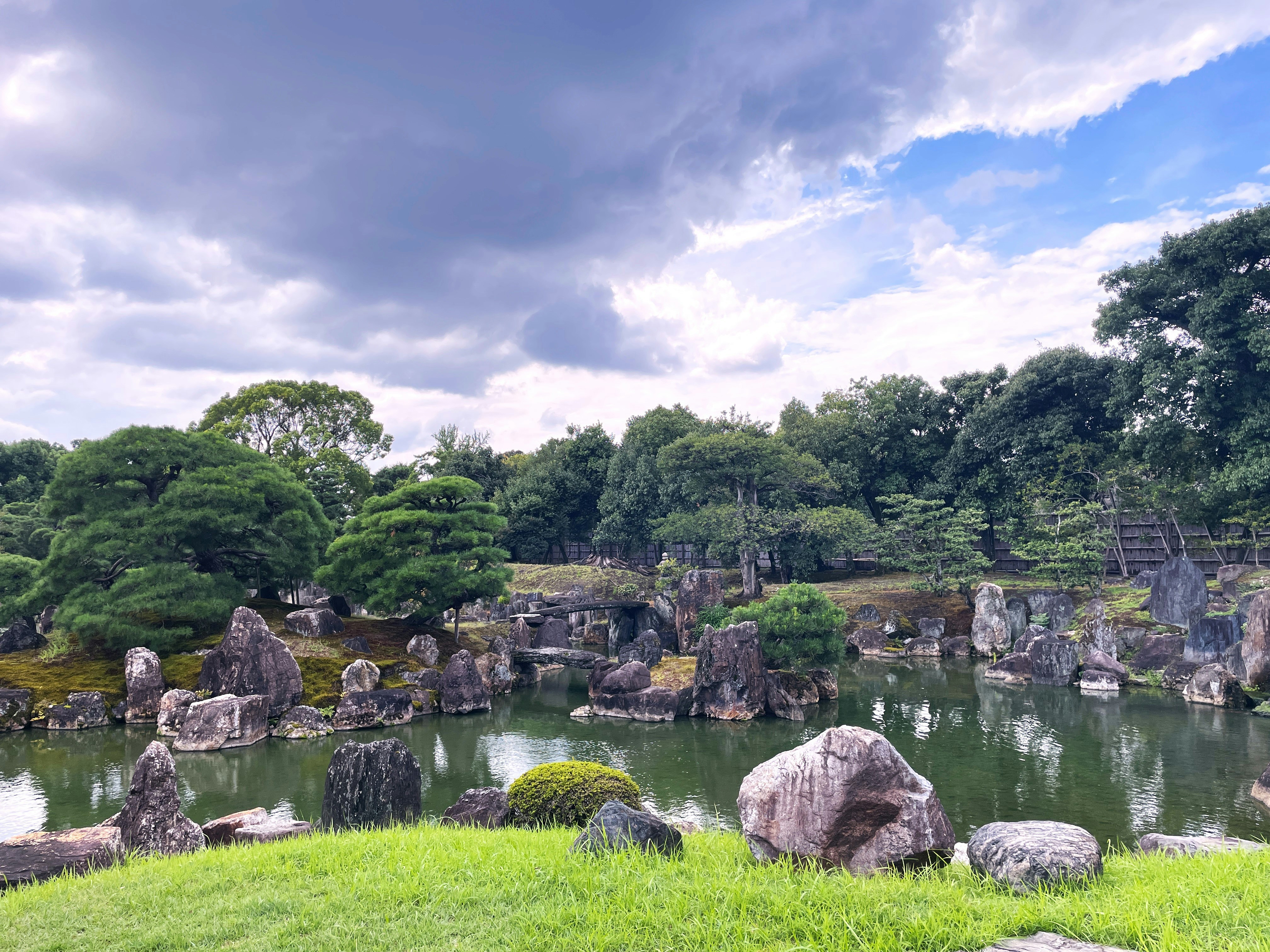 Stone Garden Reflections: Tranquil Pond and Sculpted Rocks
