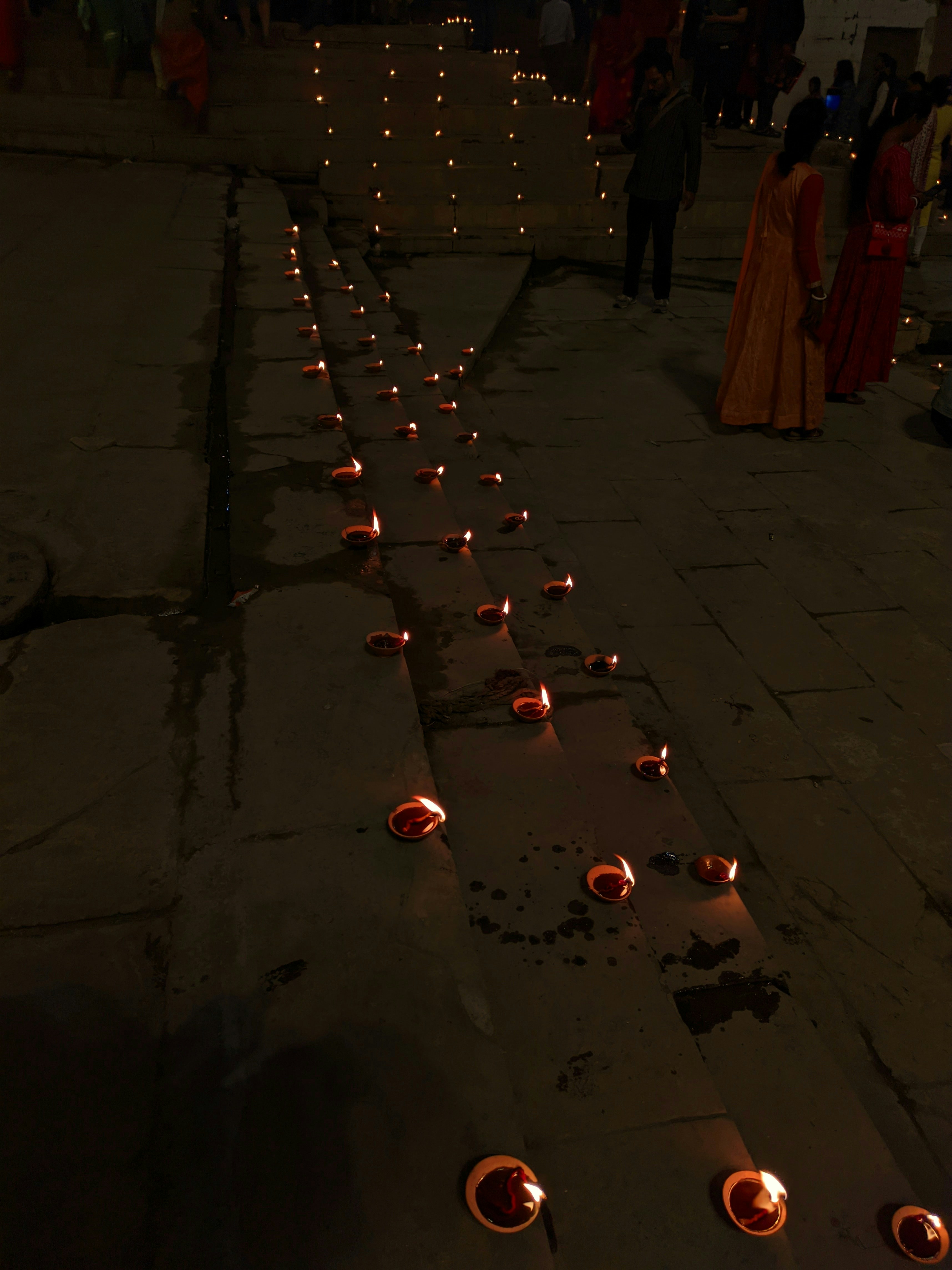 Glow on the Steps: Candles Stretch into the Night