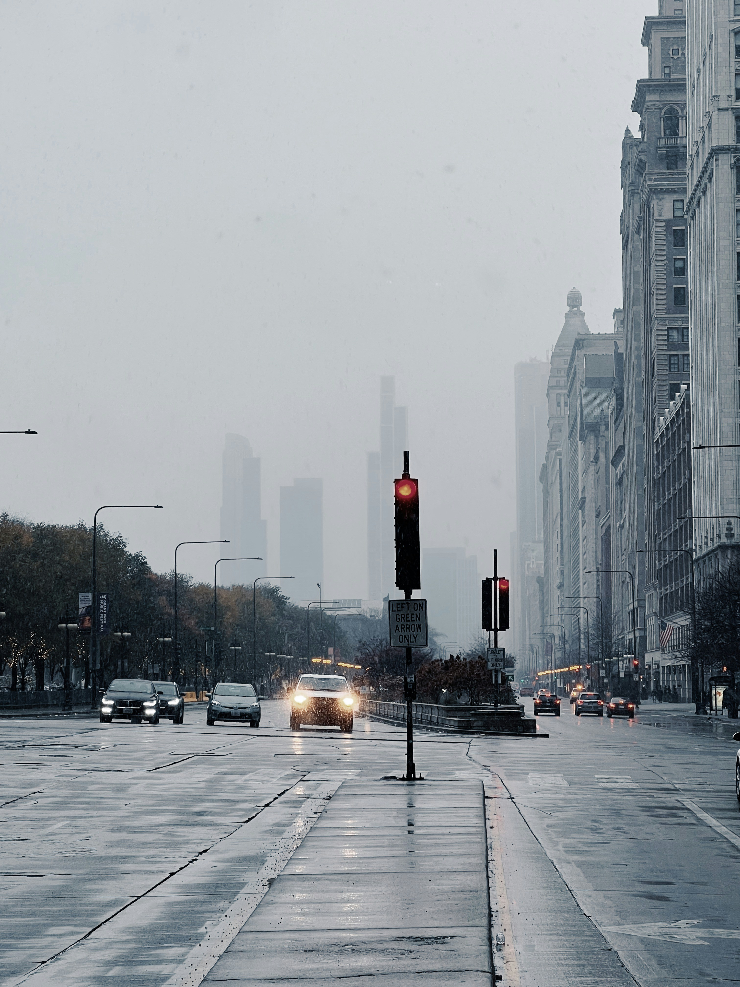Crimson Stoplight on a Drizzle-Soaked City Boulevard
