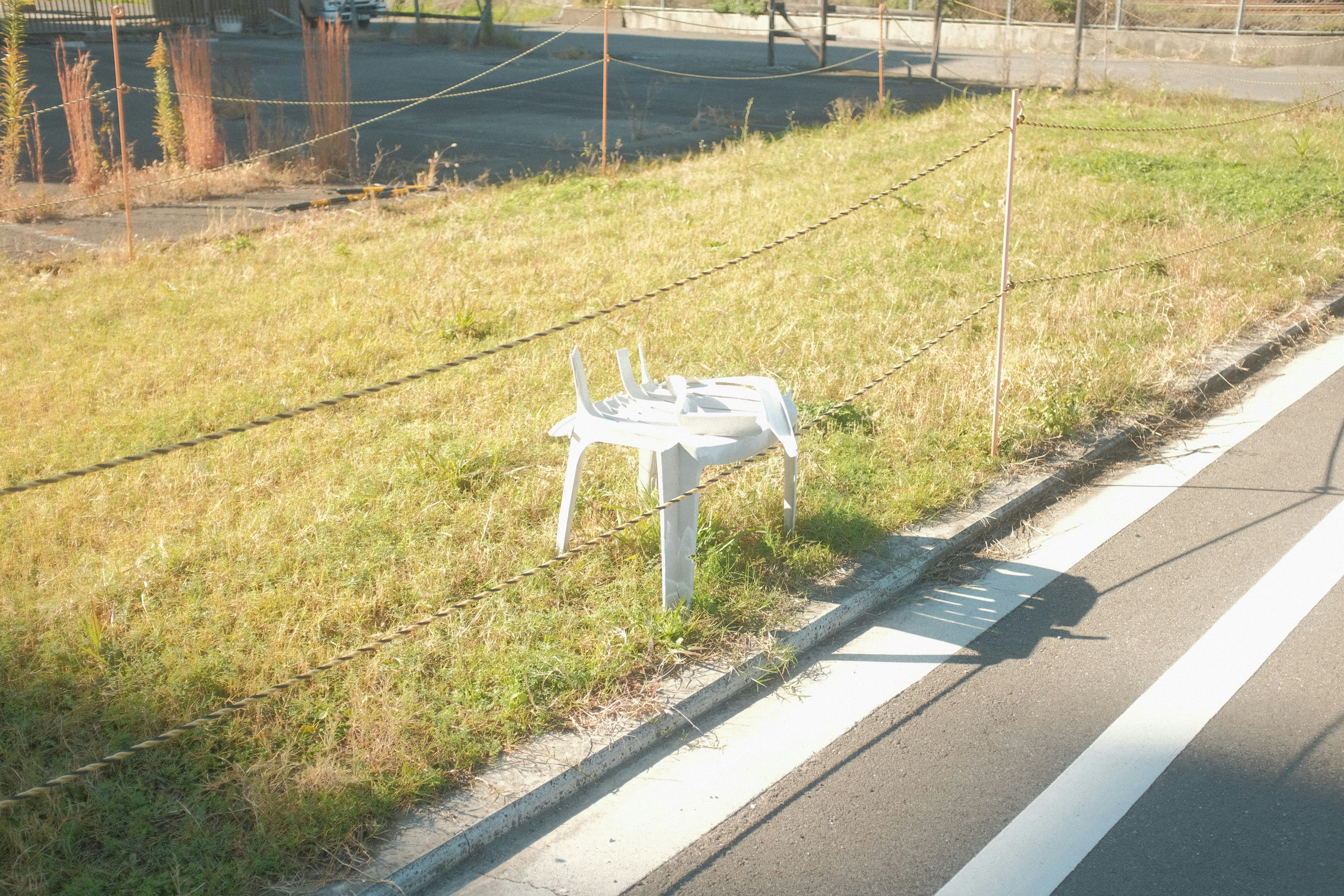 White Plastic Chair at the Verge Under Midday Sun