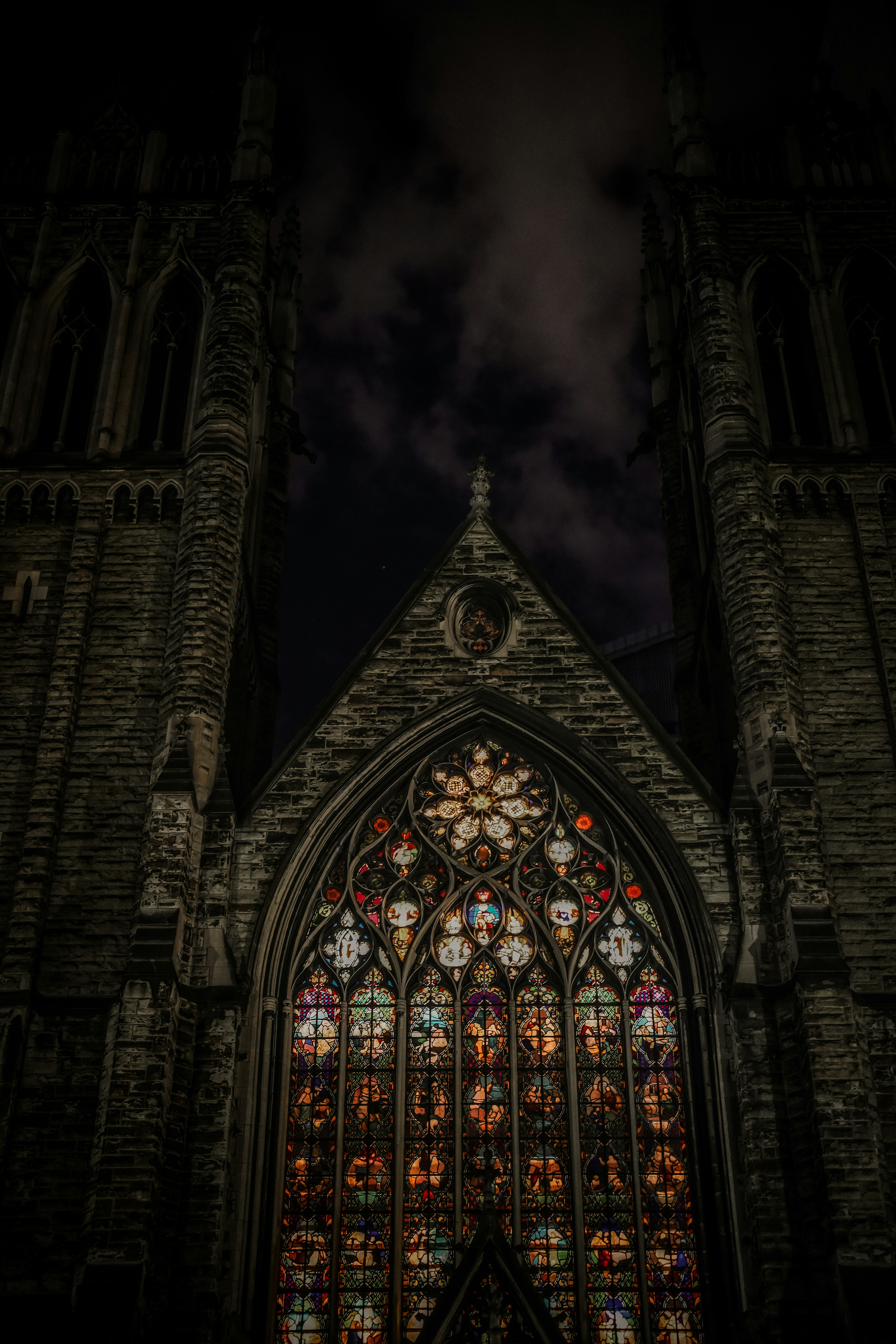 A gothic church with a large stained glass window photo – Free ...