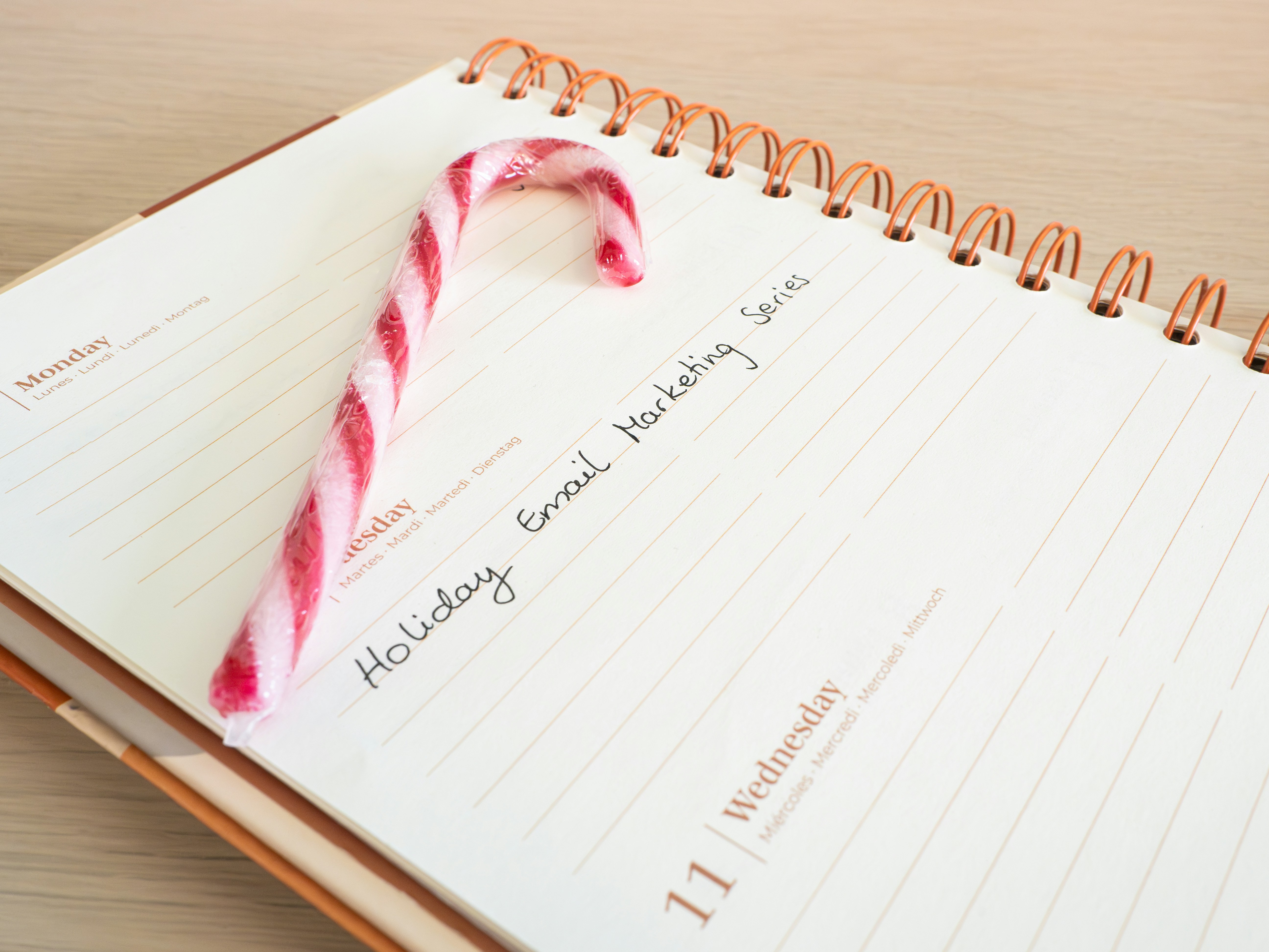 A notepad with a candy cane on top of it photo – Free Holidays Image on ...