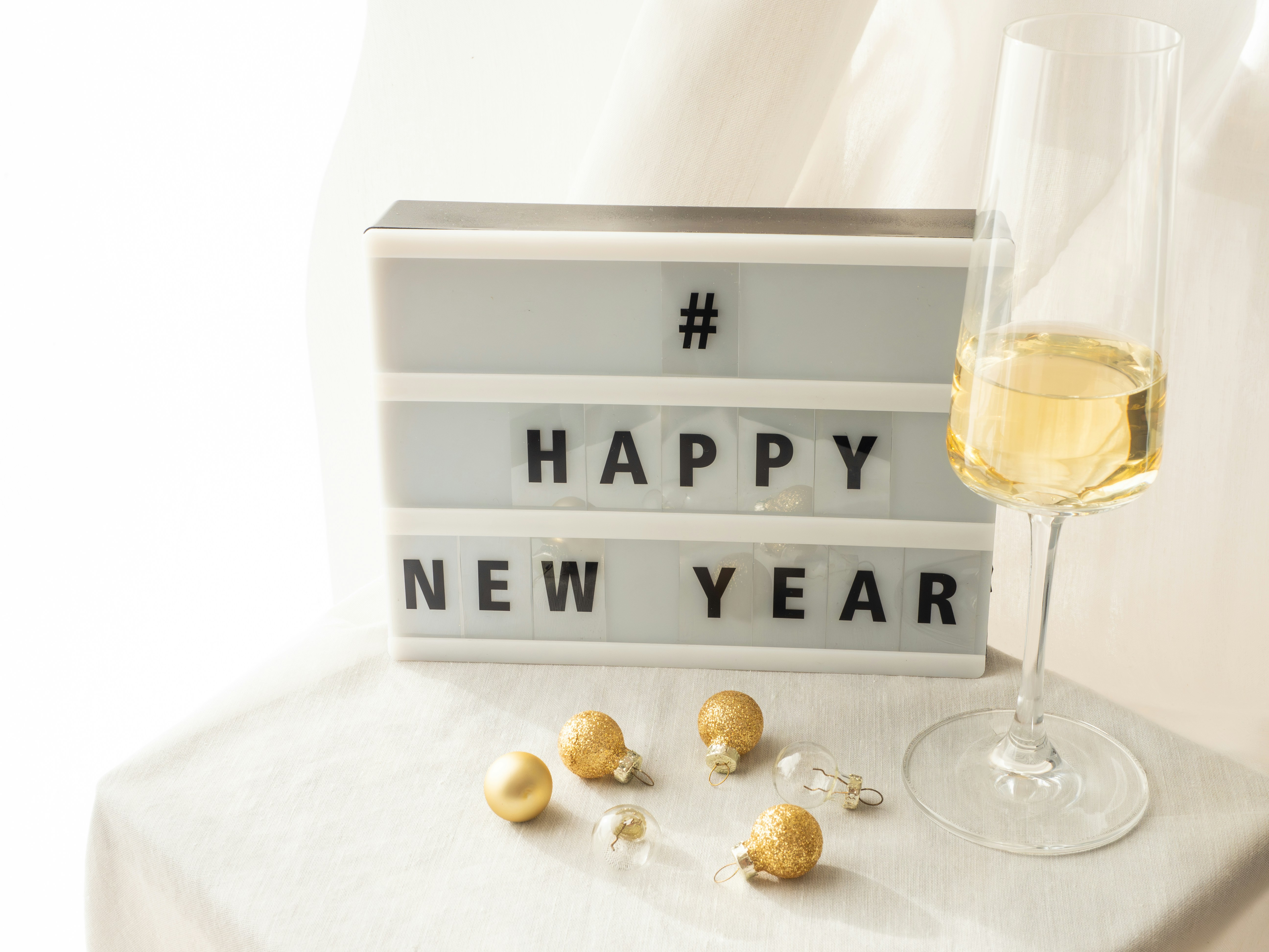Lightbox of Cheer: A New Year Glow with Toasts and Glitter