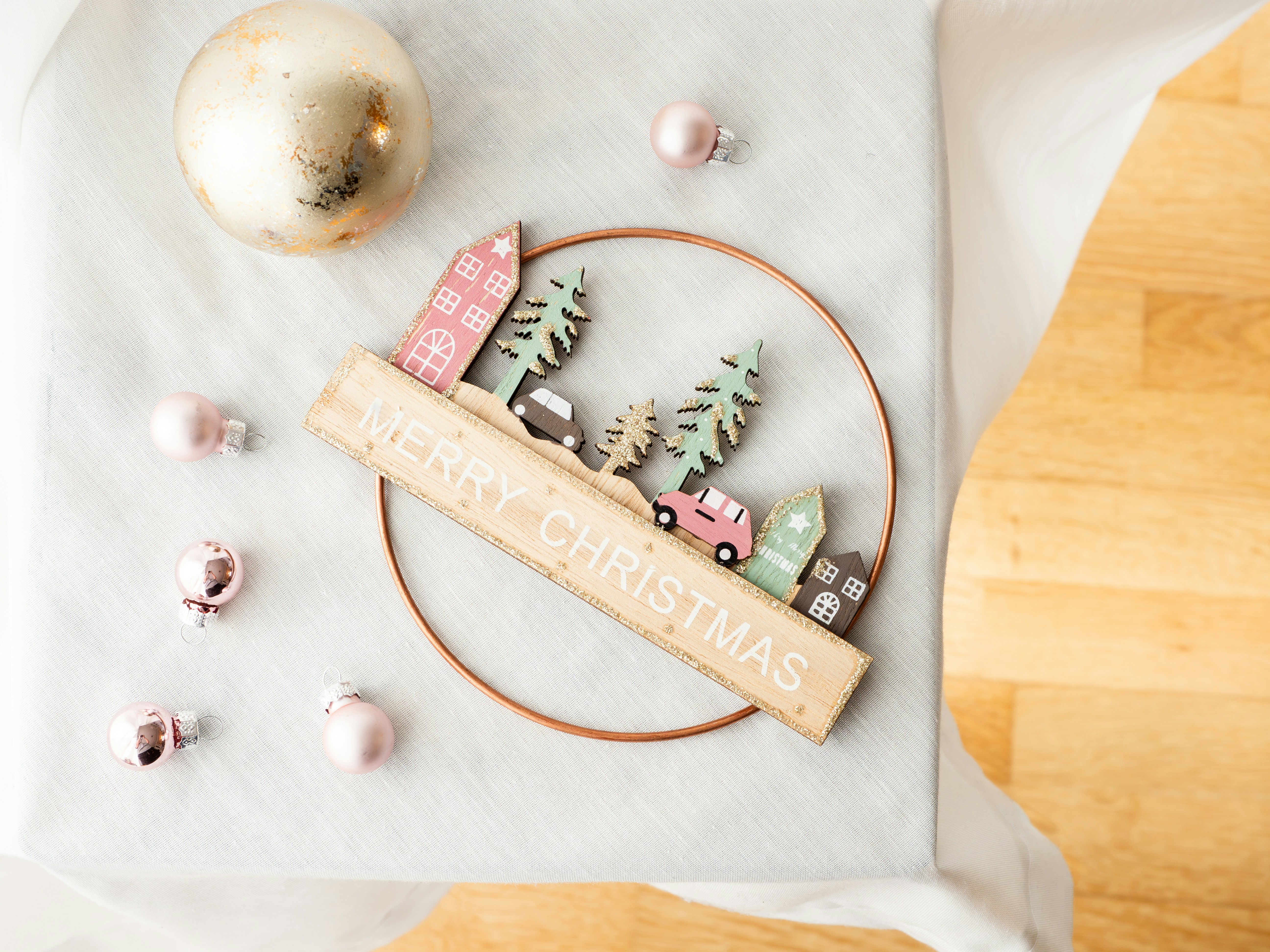 Christmas decorations on a table with a white cloth