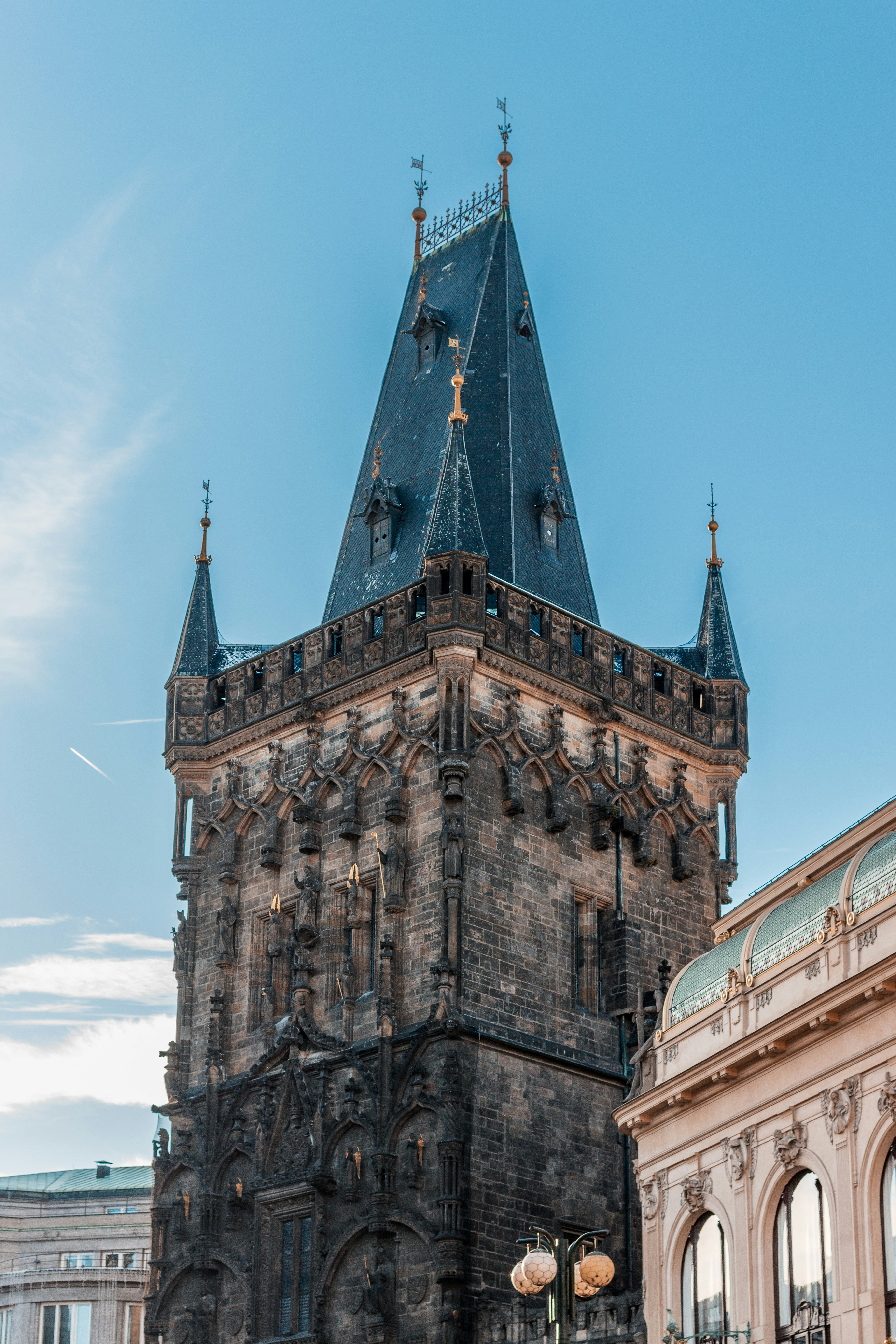 Slate-Spired Gothic Tower Reaching Toward a Clear Sky
