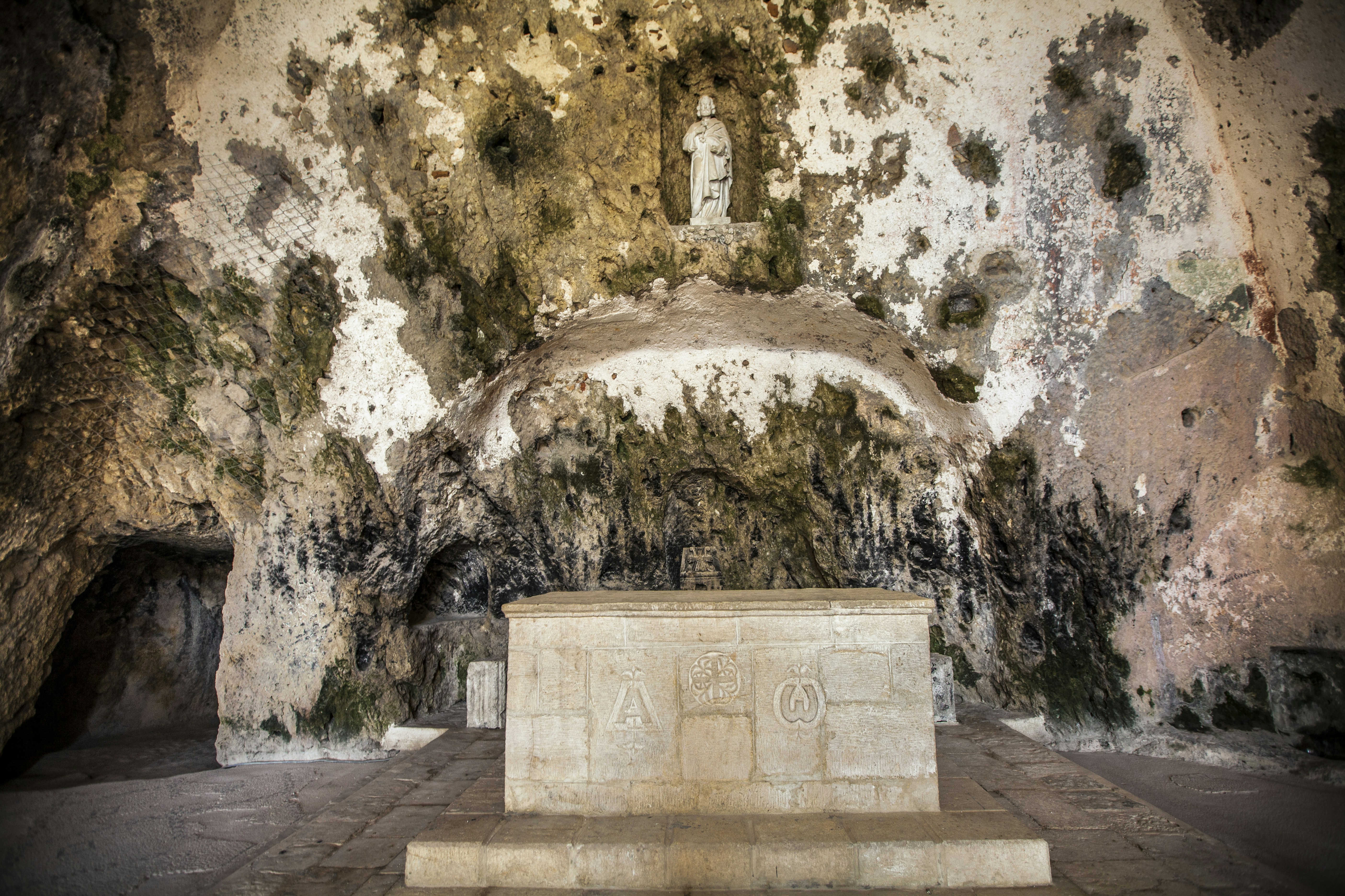 Chamber of Stones: The Altar Niche Beneath the Mossy Cloister