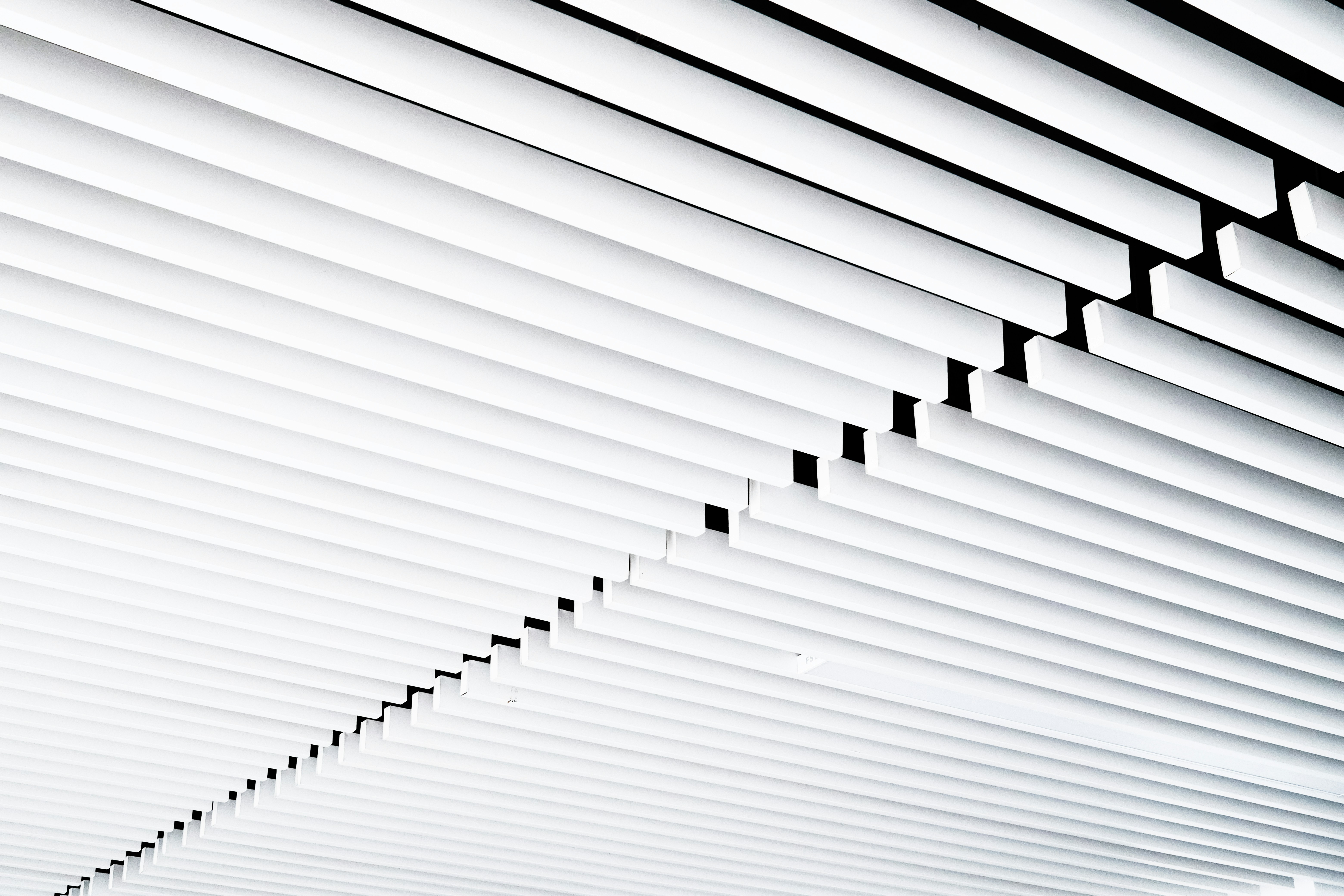 A long line of white lines on a ceiling photo – Free White Image on ...