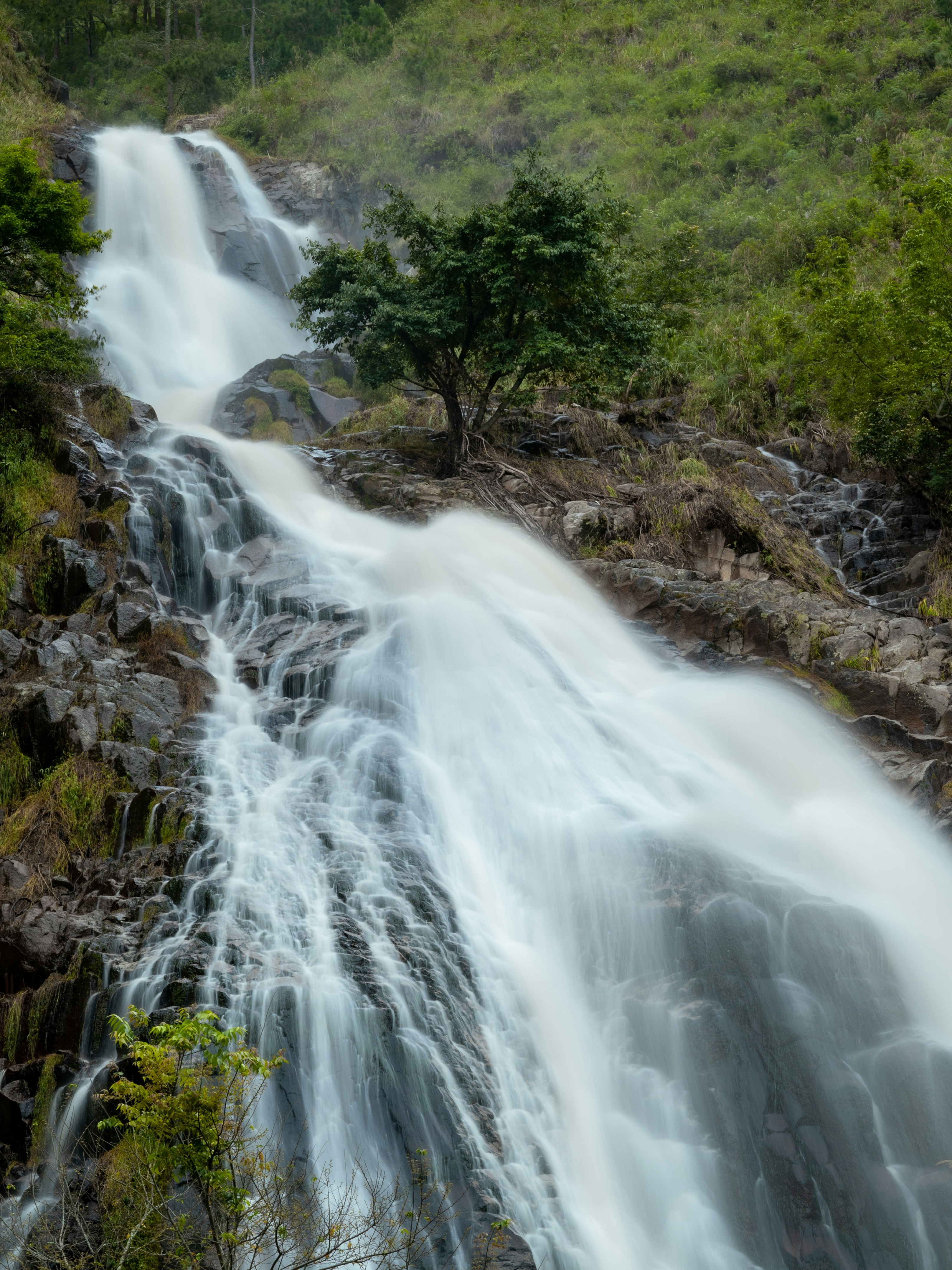 A very tall waterfall with lots of water photo – Free Indonesia Image ...