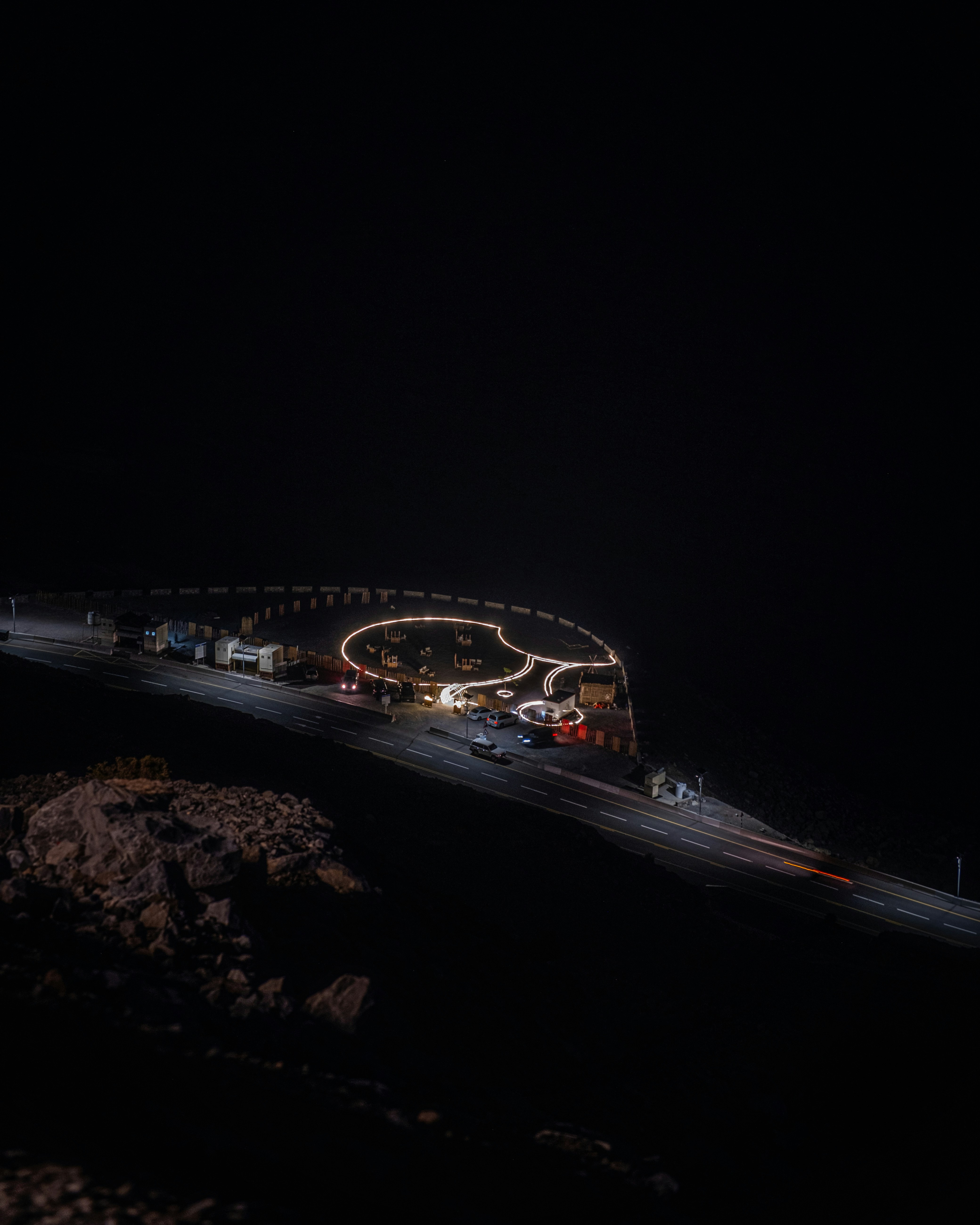 Neon Ring Along the Cliffside Crescent