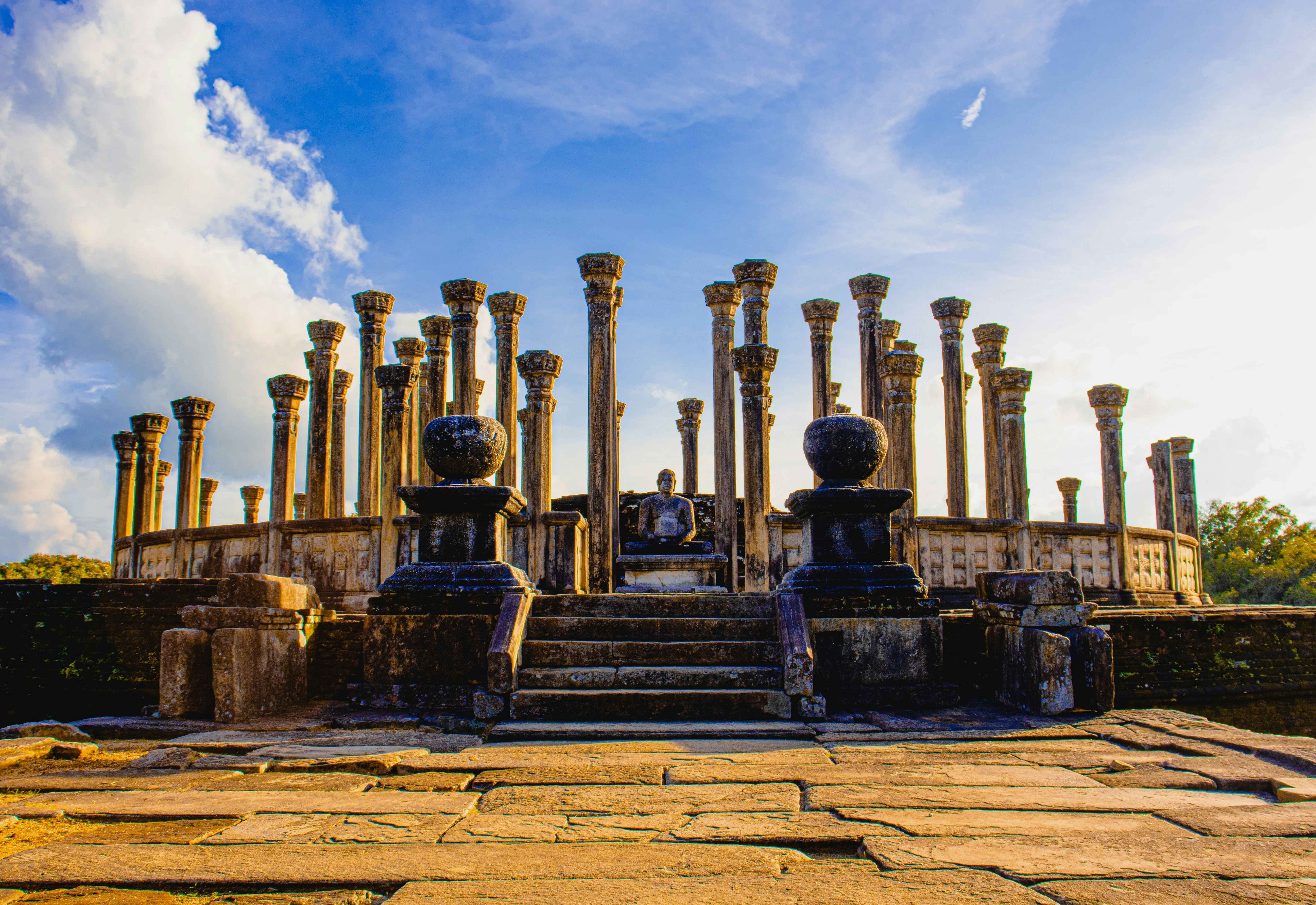 A group of stone pillars sitting next to each other photo – Free ...