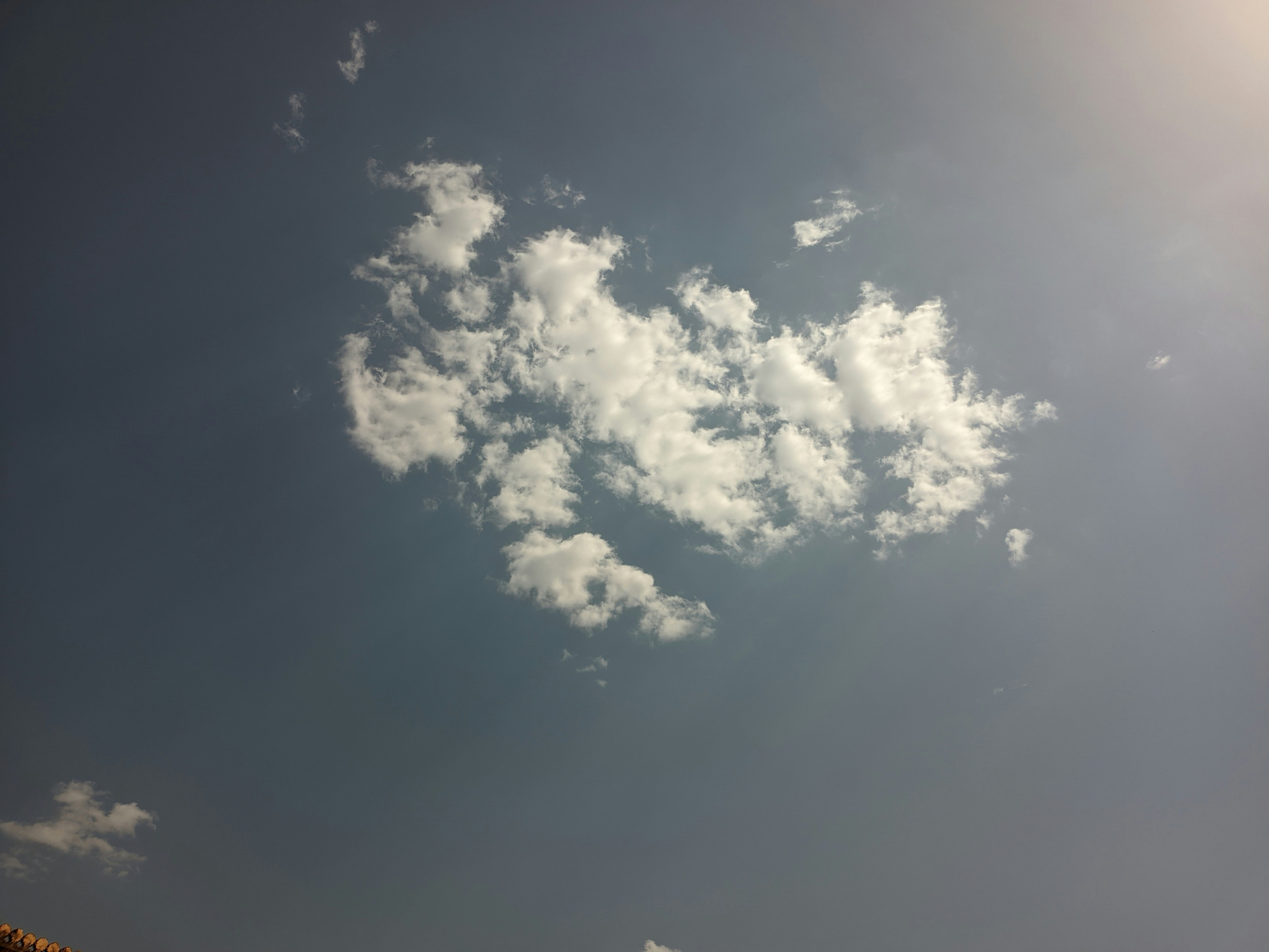 Patch of Sky: A Quiet Cloudscape Under a Bright Day