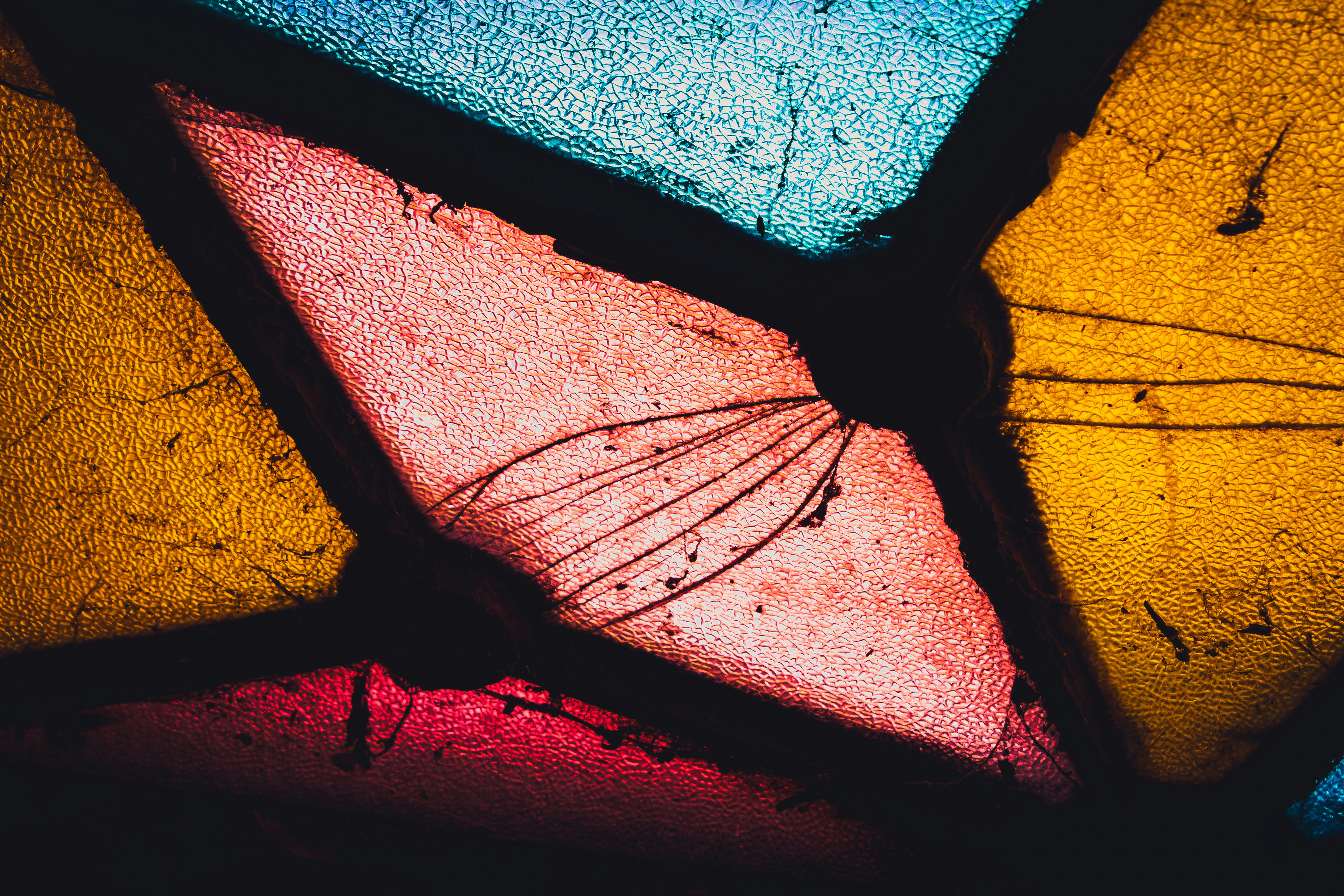 Cracked Prism: Close-Up of Neon Graffiti Glass