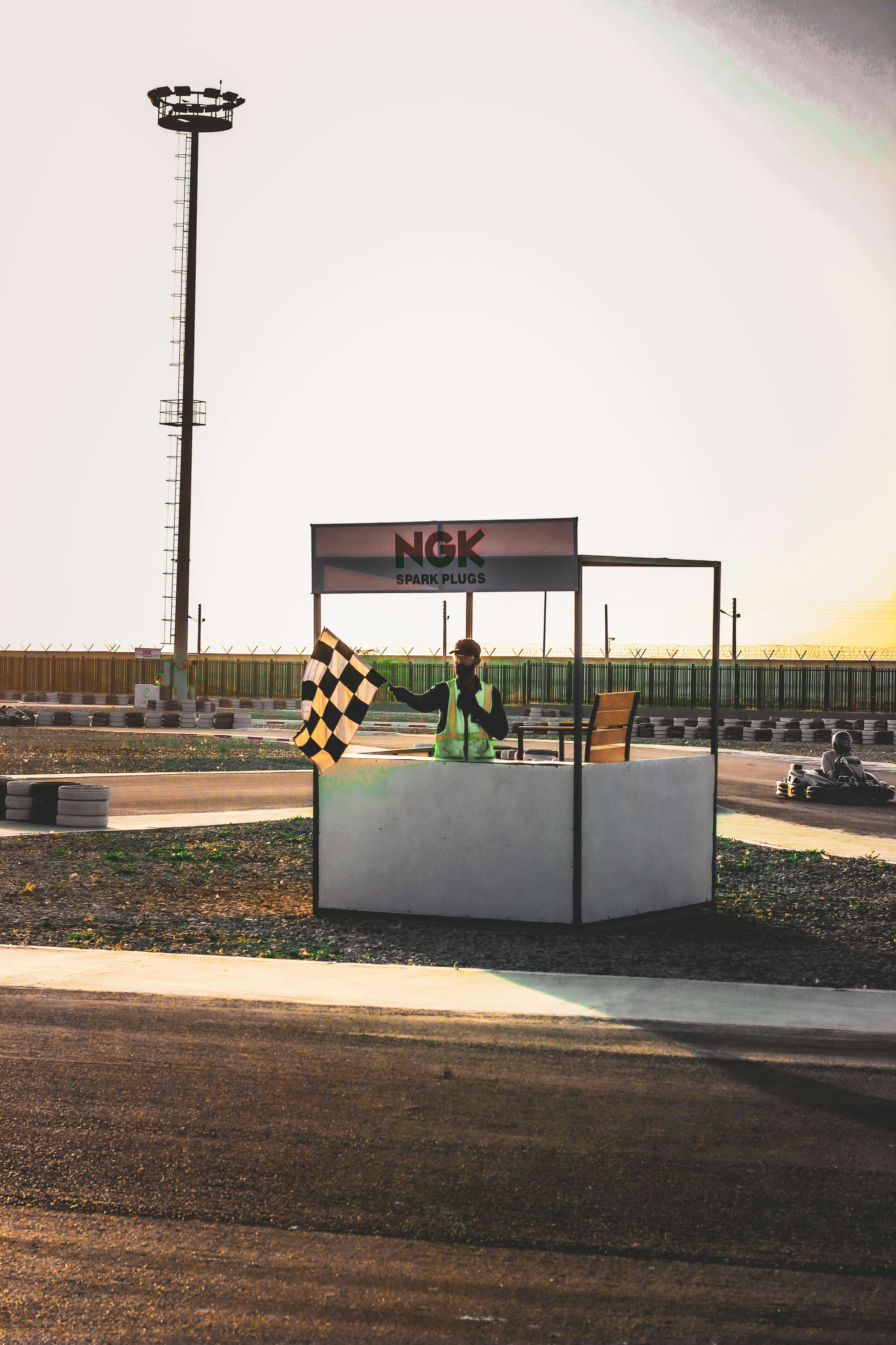 A checkered checkered flag is in front of a checkered booth photo ...