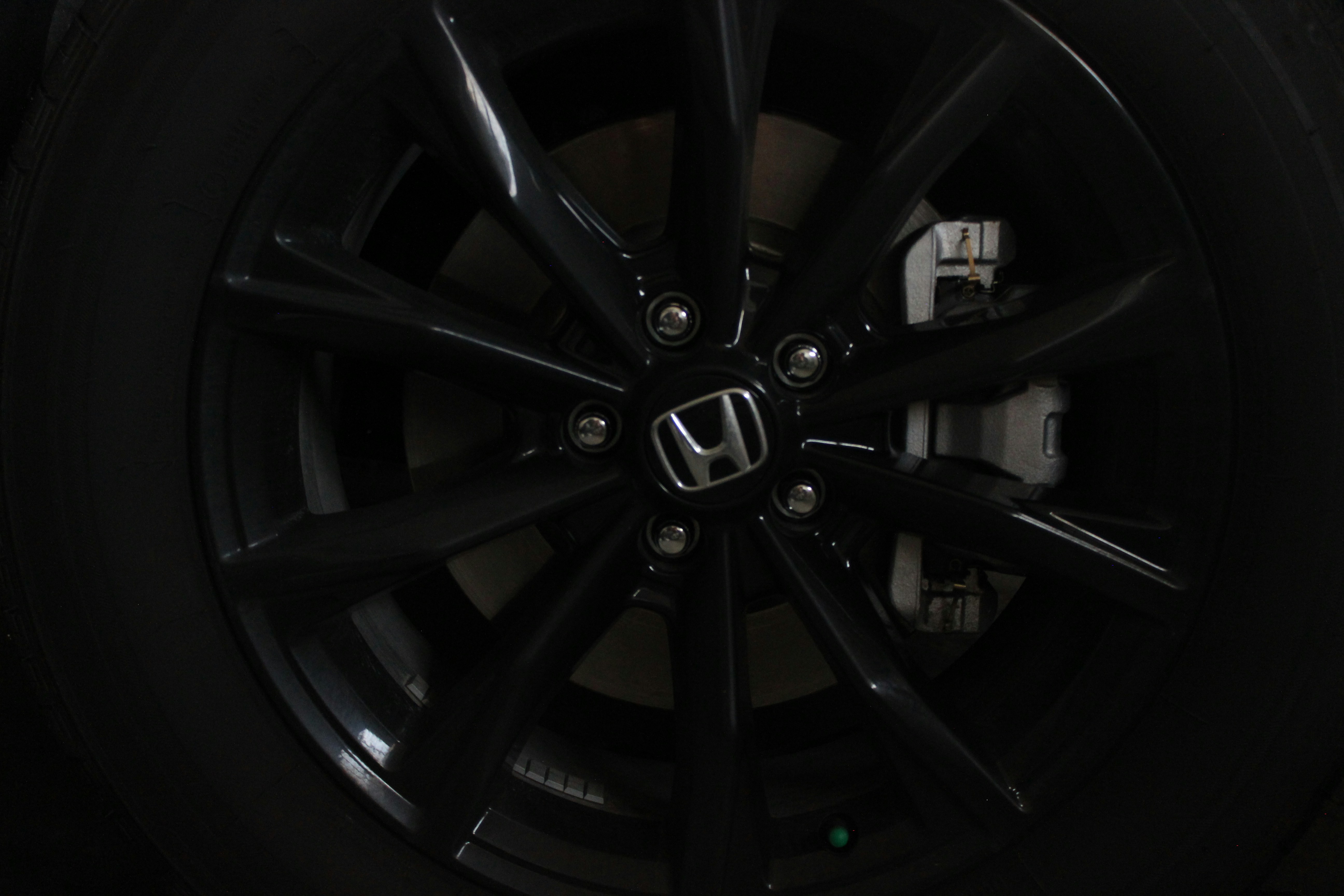 Dark Alloy: Honda Wheel with Subtle Green Accent